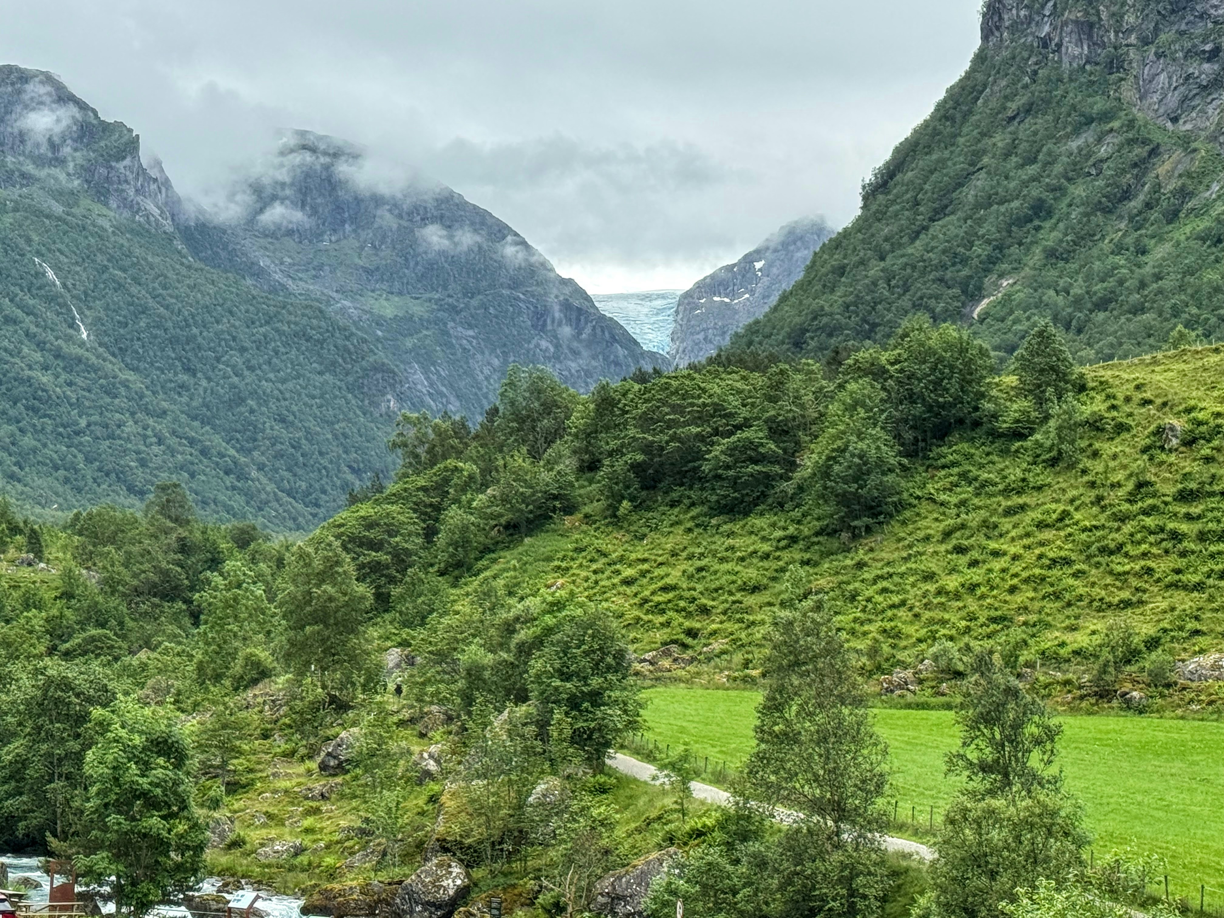 Valley Bend Under Cloud-Wedged Peaks