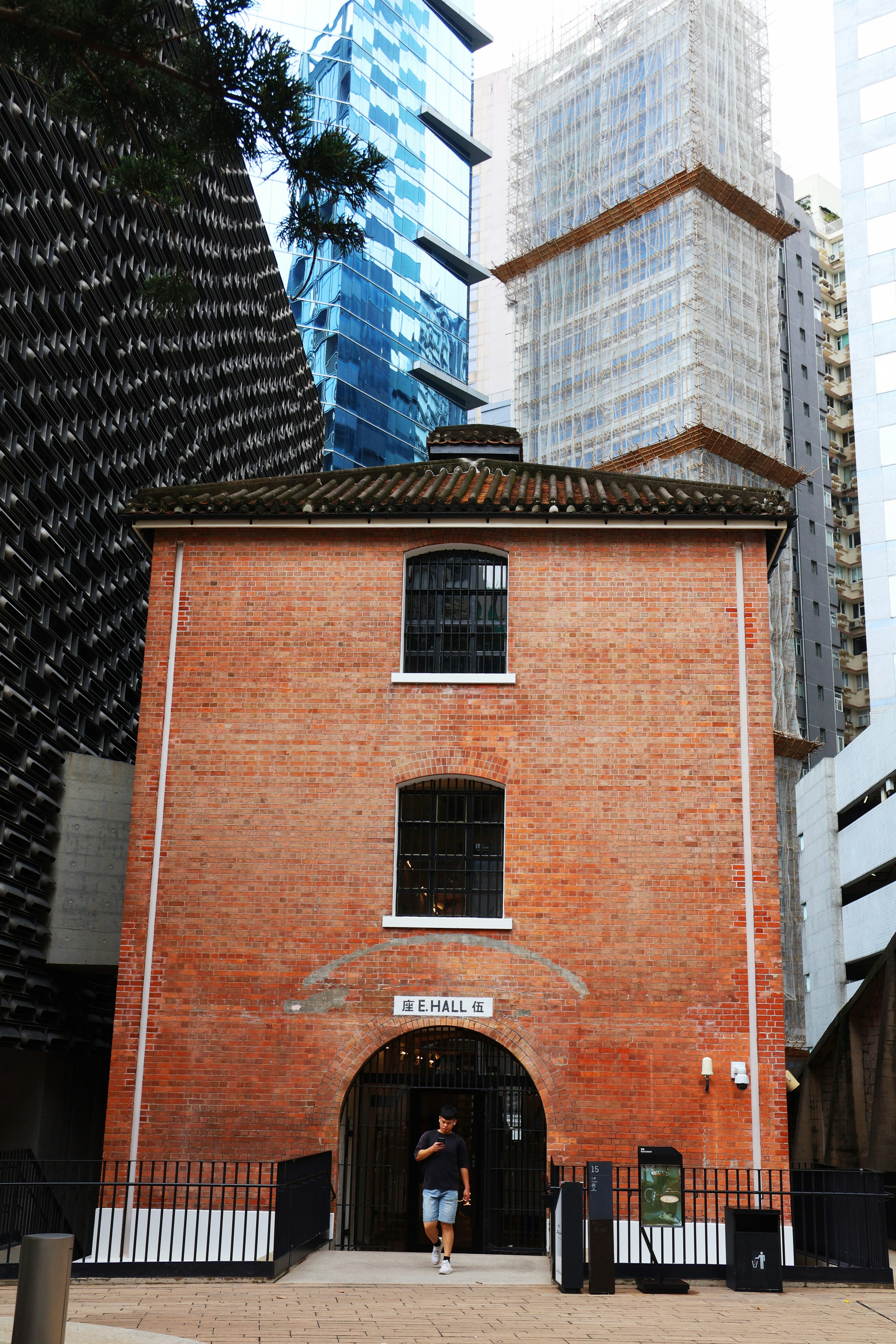 Brick Gatehouse Amidst Skyscrapers