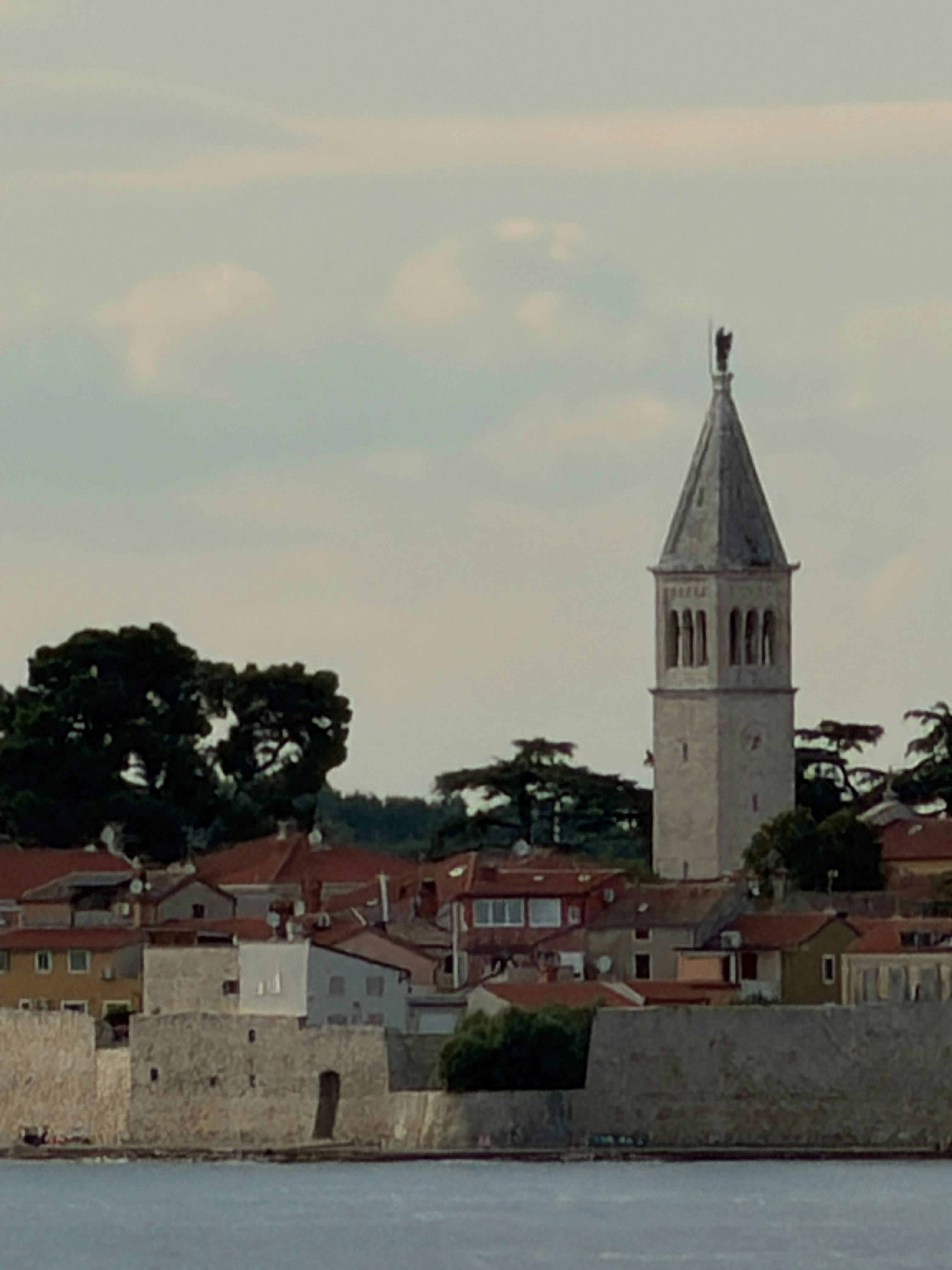 Bell Tower by the Harbor: A Mediterranean Vista