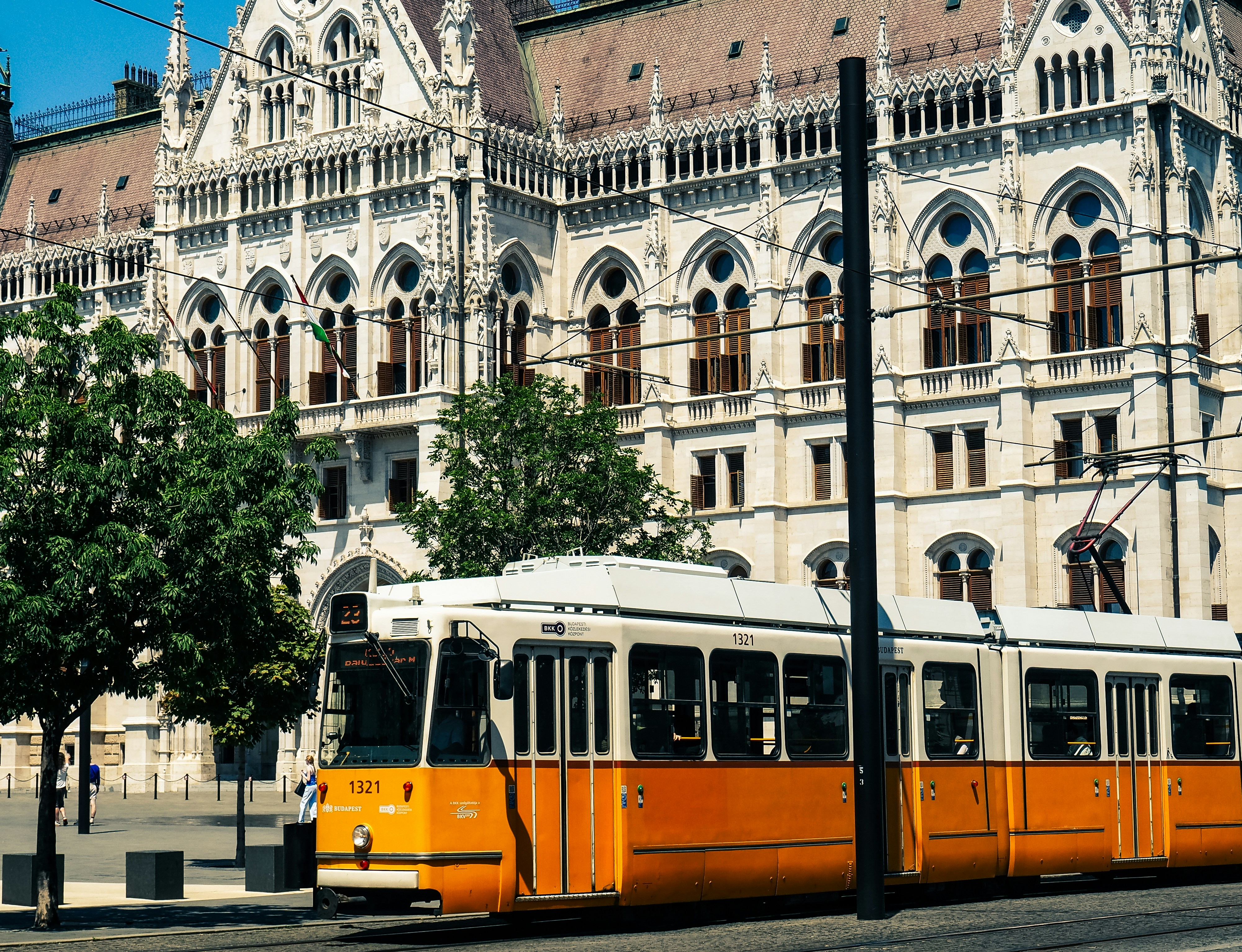 Golden Tram Passing the Gothic Facade
