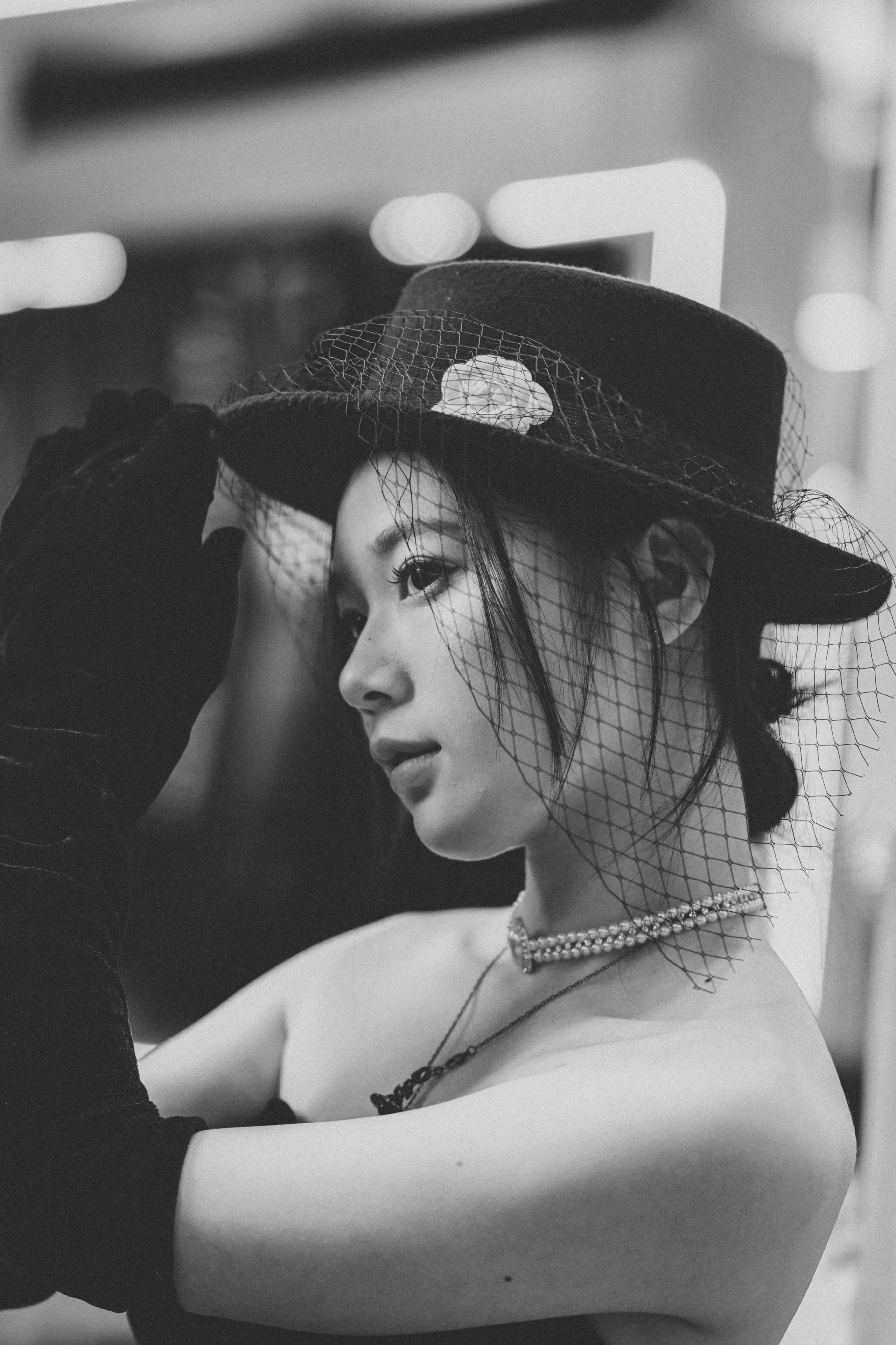 Veiled Gaze in Noir Elegance