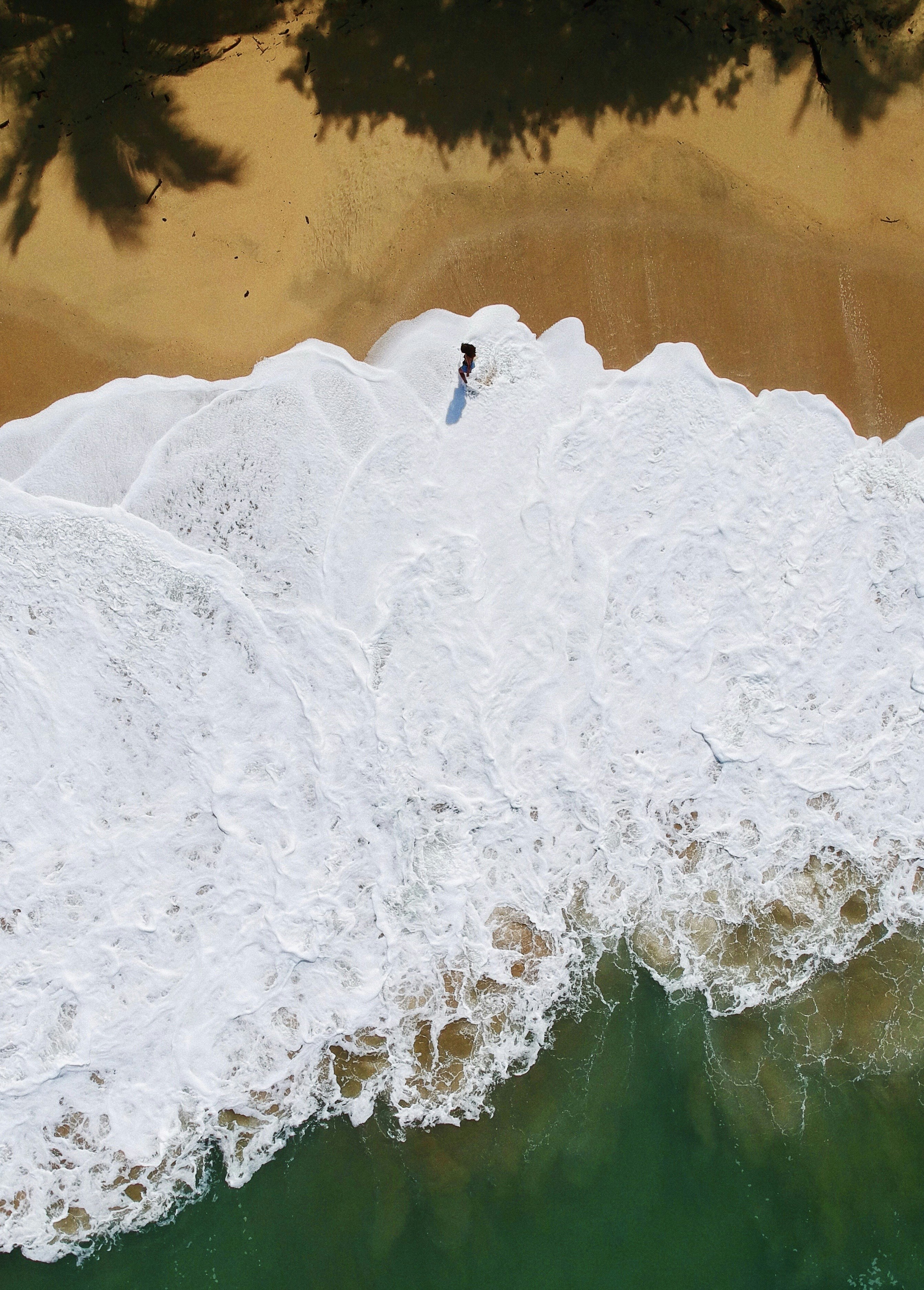 Edge of White Tide: A Drone’s Eye View of Surf and Sand