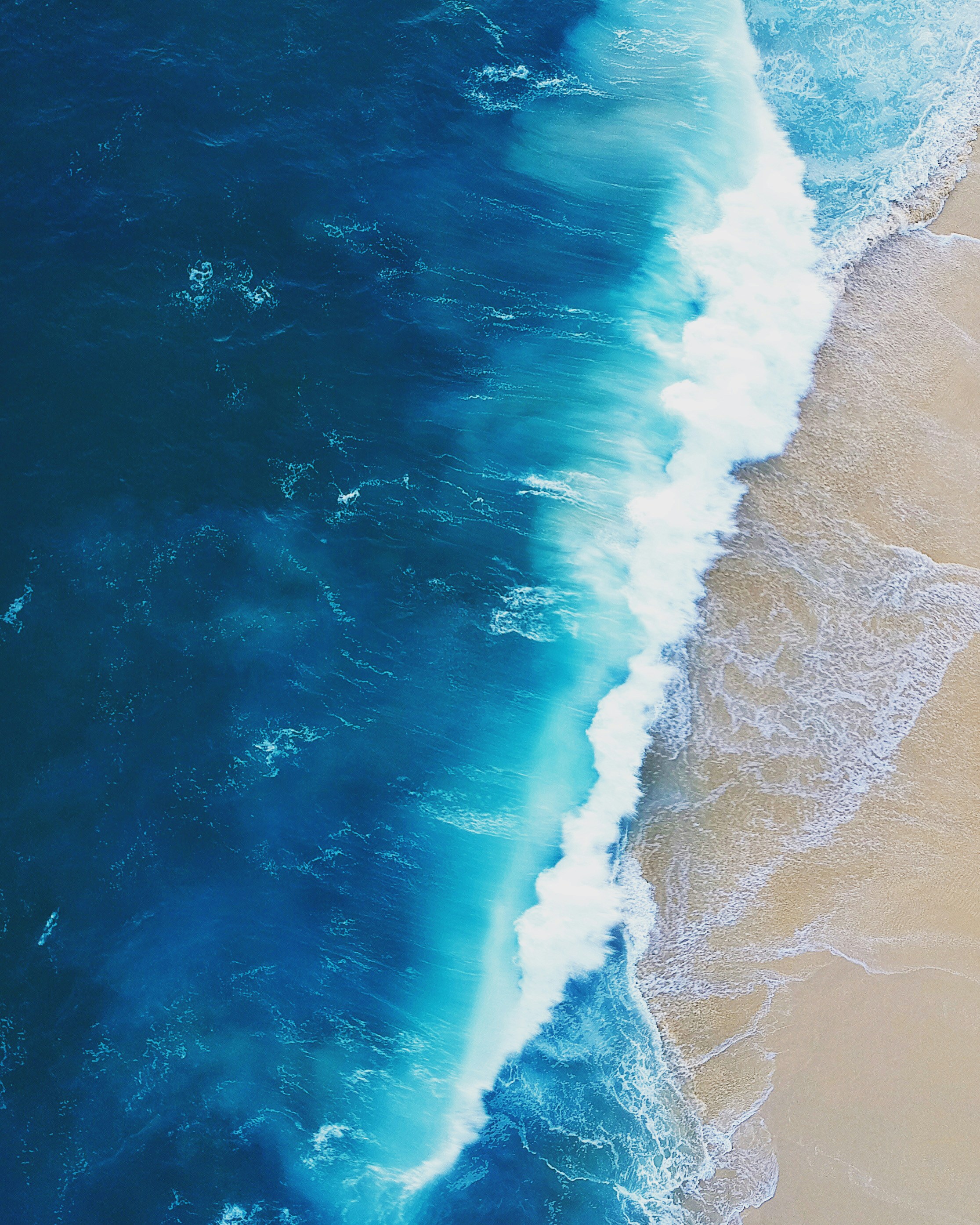 Where Sea Meets Sand: Aerial Blue Verge