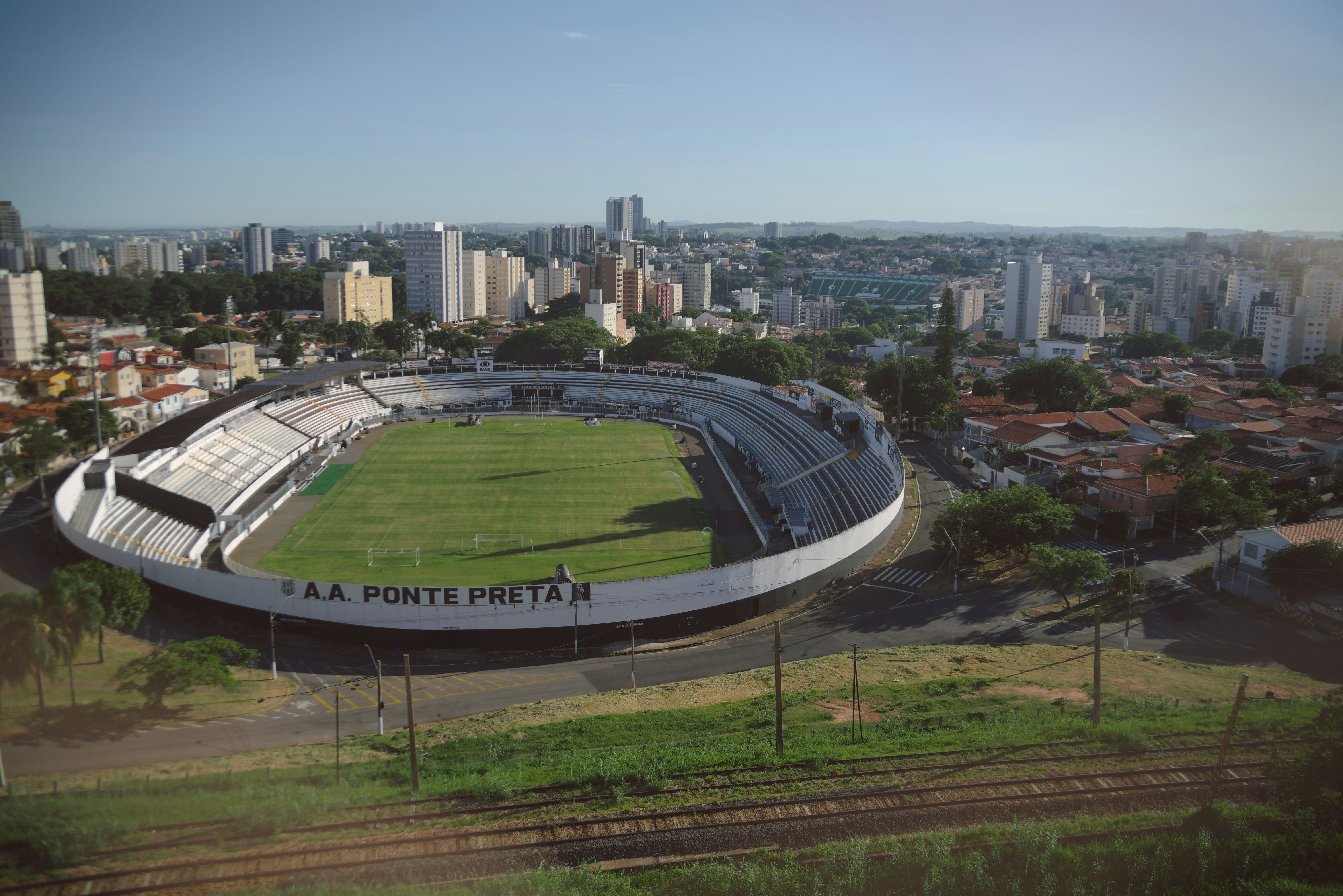 Rings of a City: Aerial View of K.A. Ponte Preta Stadium Amidst Urban Grid
