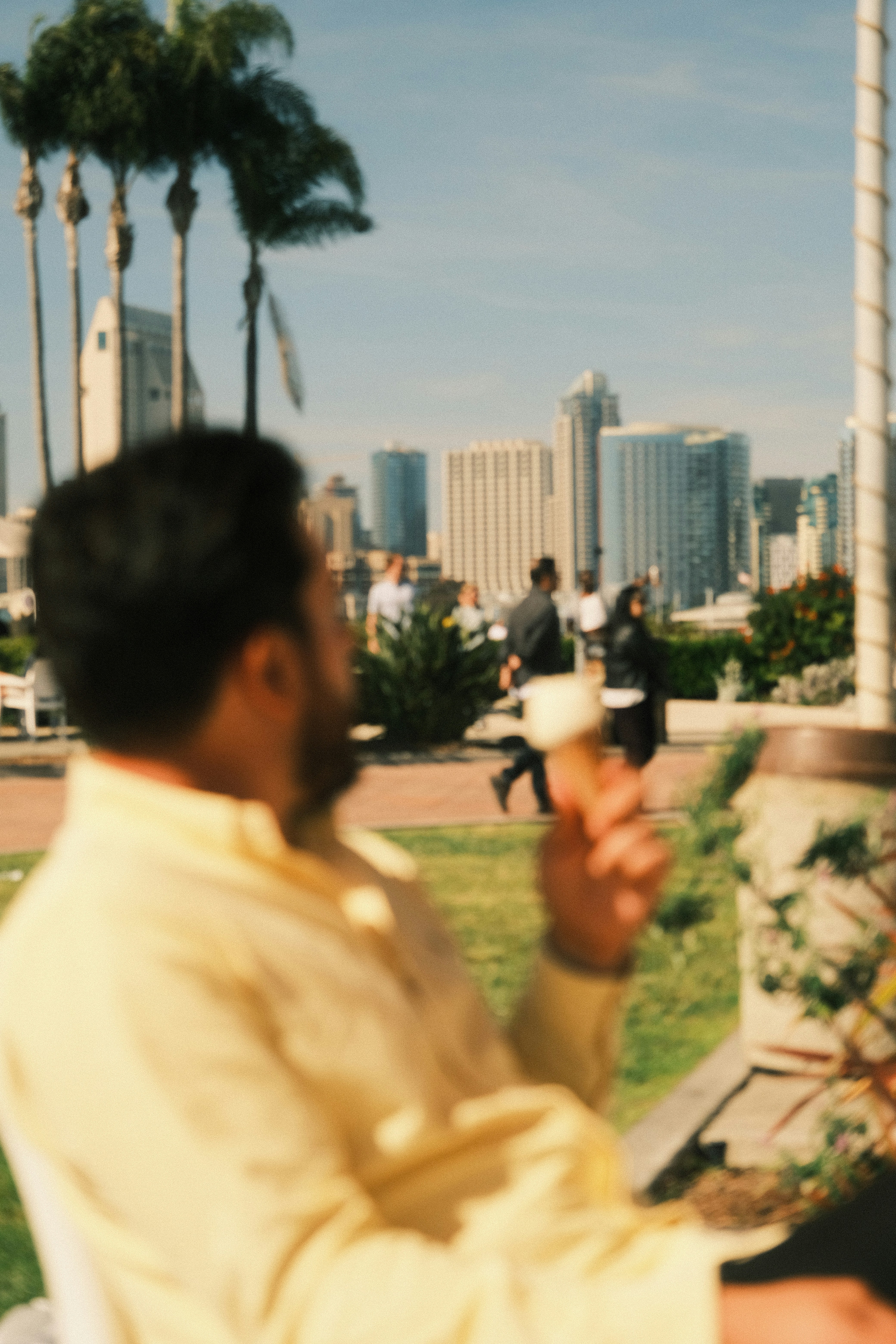 Soft Focus City Perch: A Relaxed Moment with Ice Cream