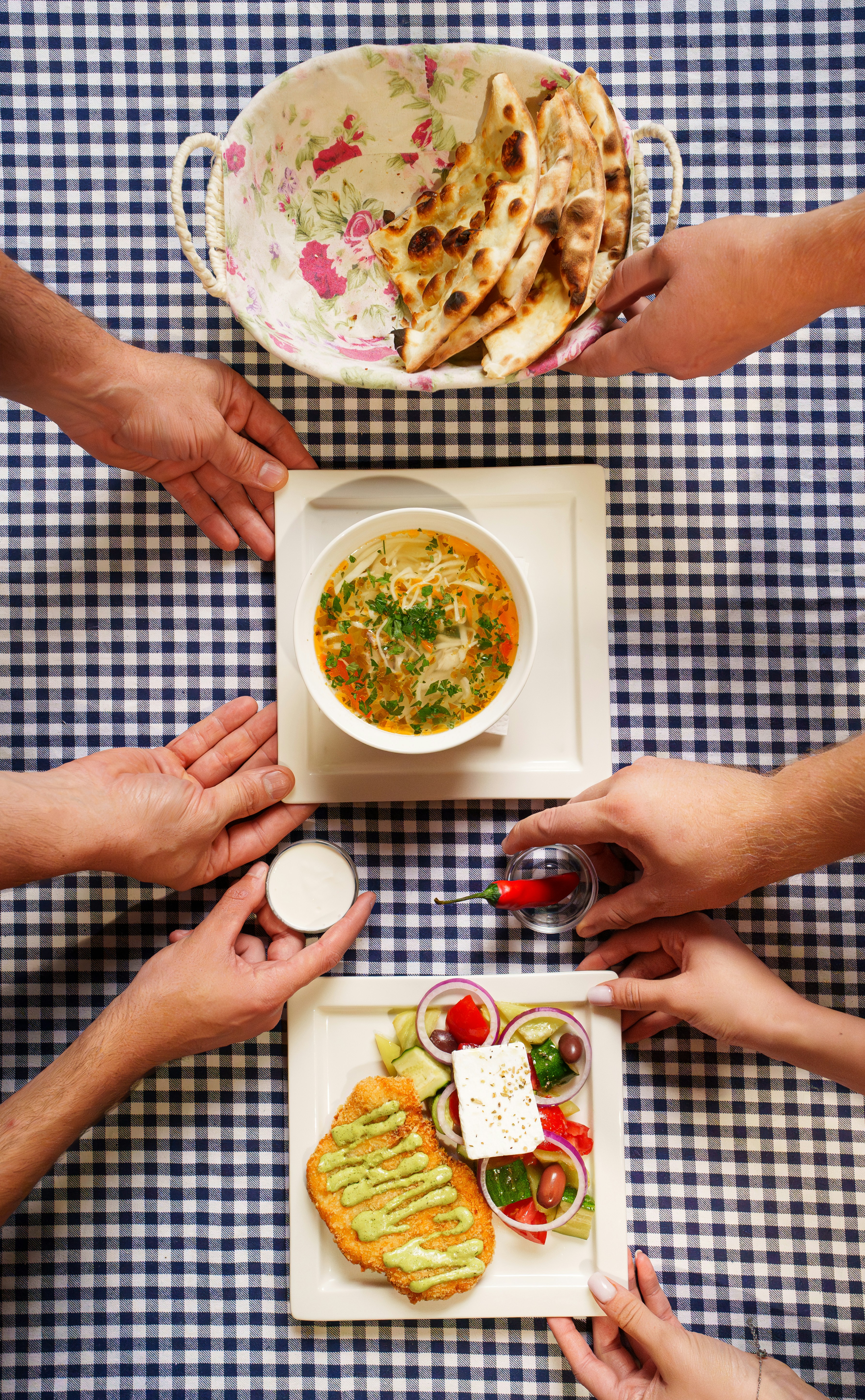 Shared Meal Under a Checkered Sky