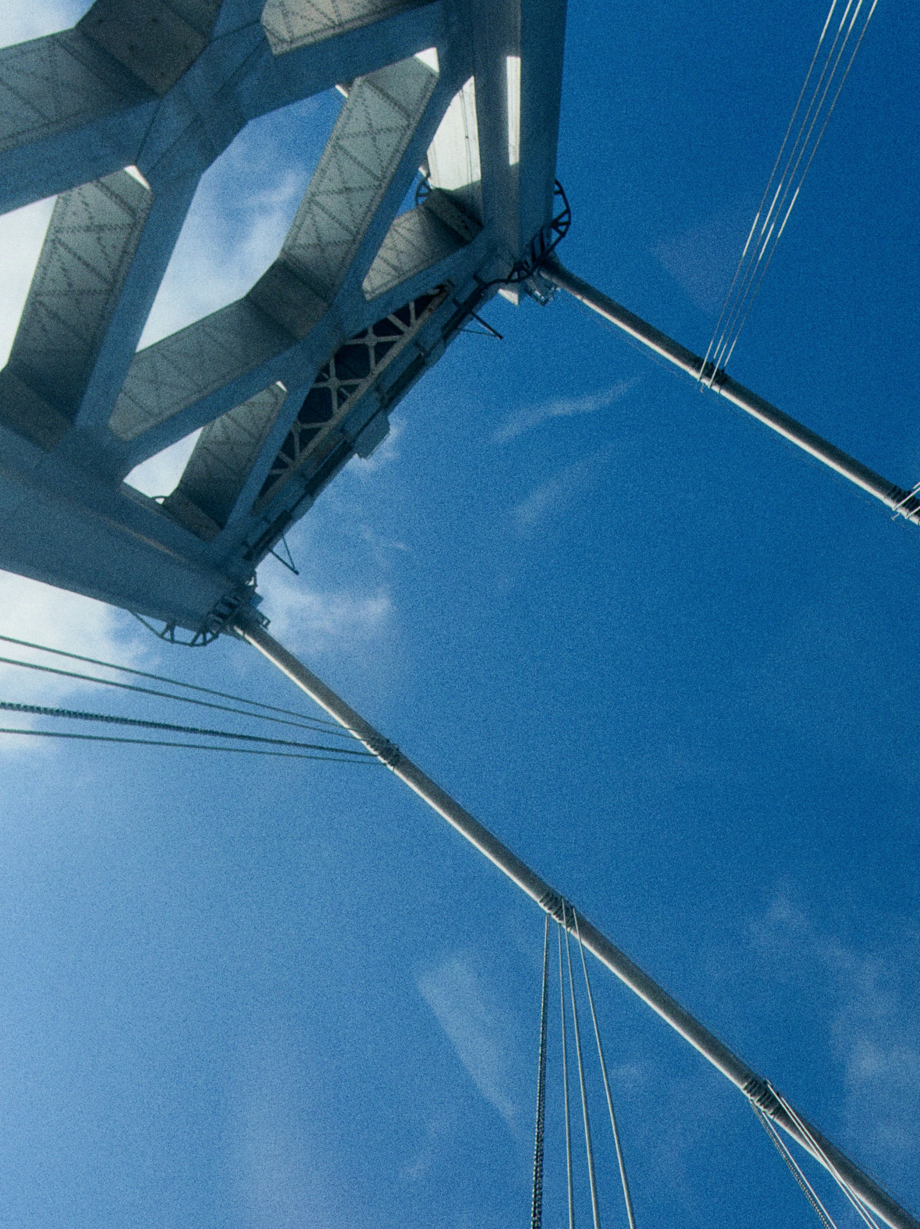 Under the Hull: A Bridge Tower Reaching into a Clear Sky