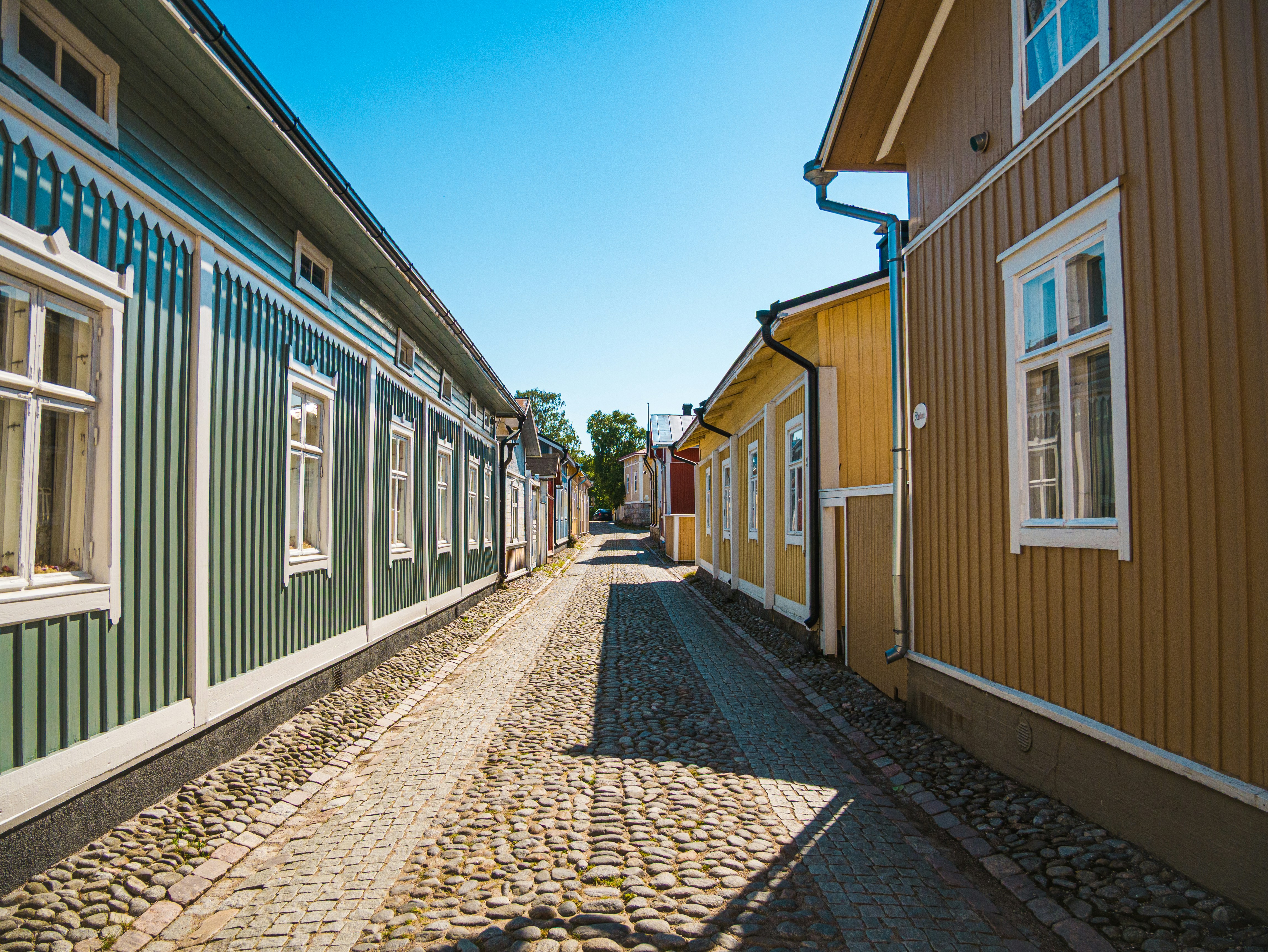 Sunlit Alley of Painted Archives