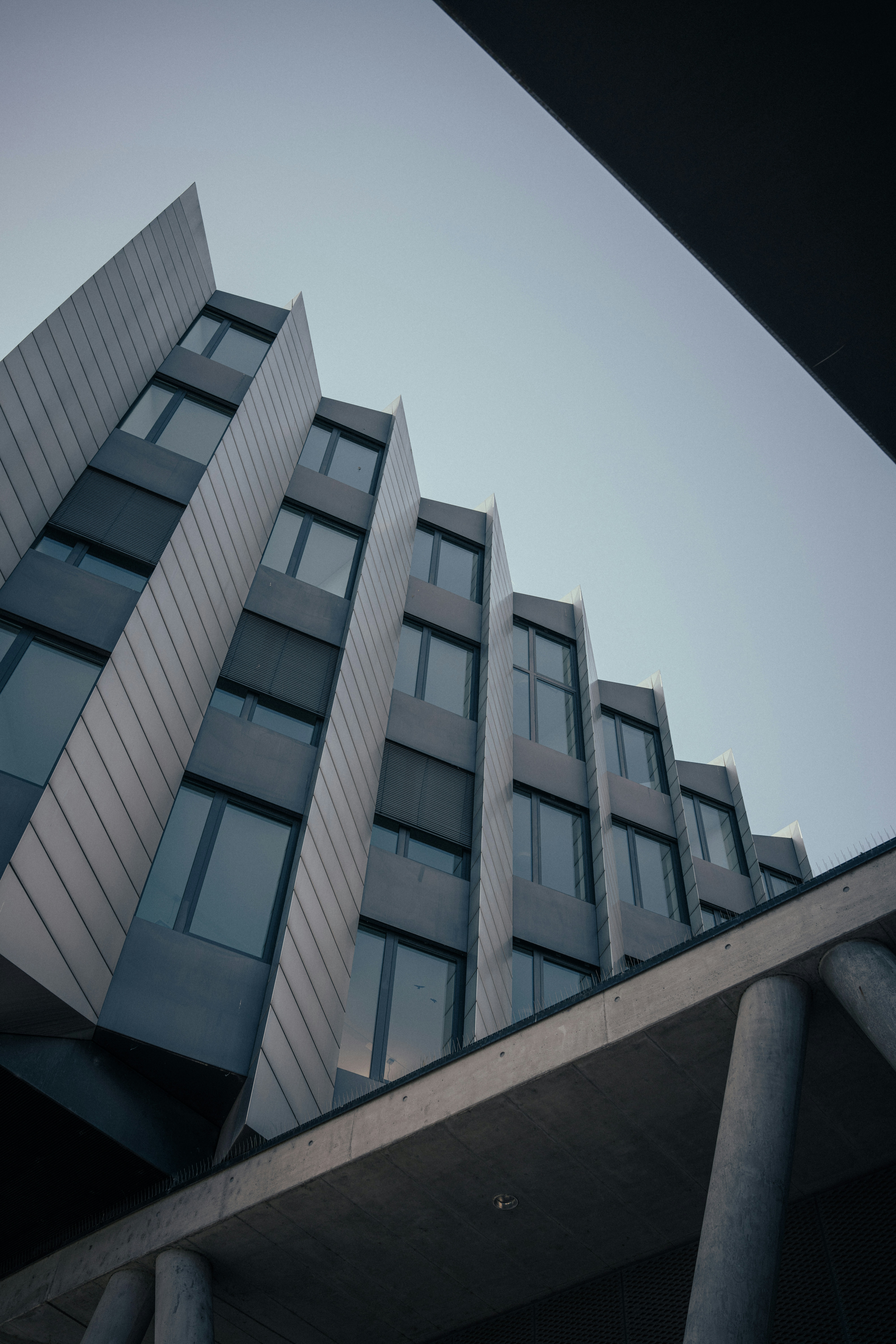 Architectural Angles: Steel Facades Rising Into a Clear Sky