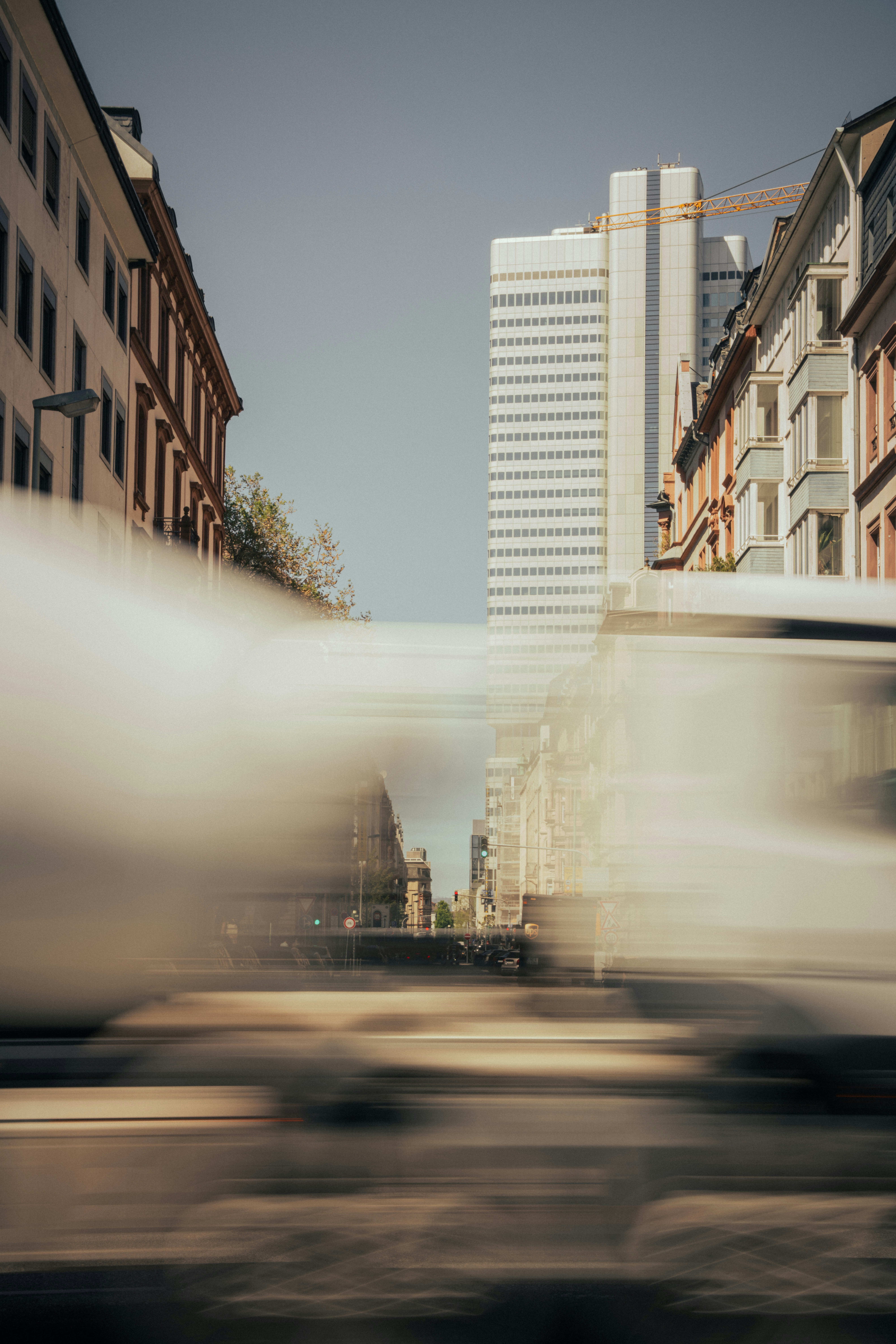 Blurred Street Pulse: A City in Motion Under a Tall Skyline