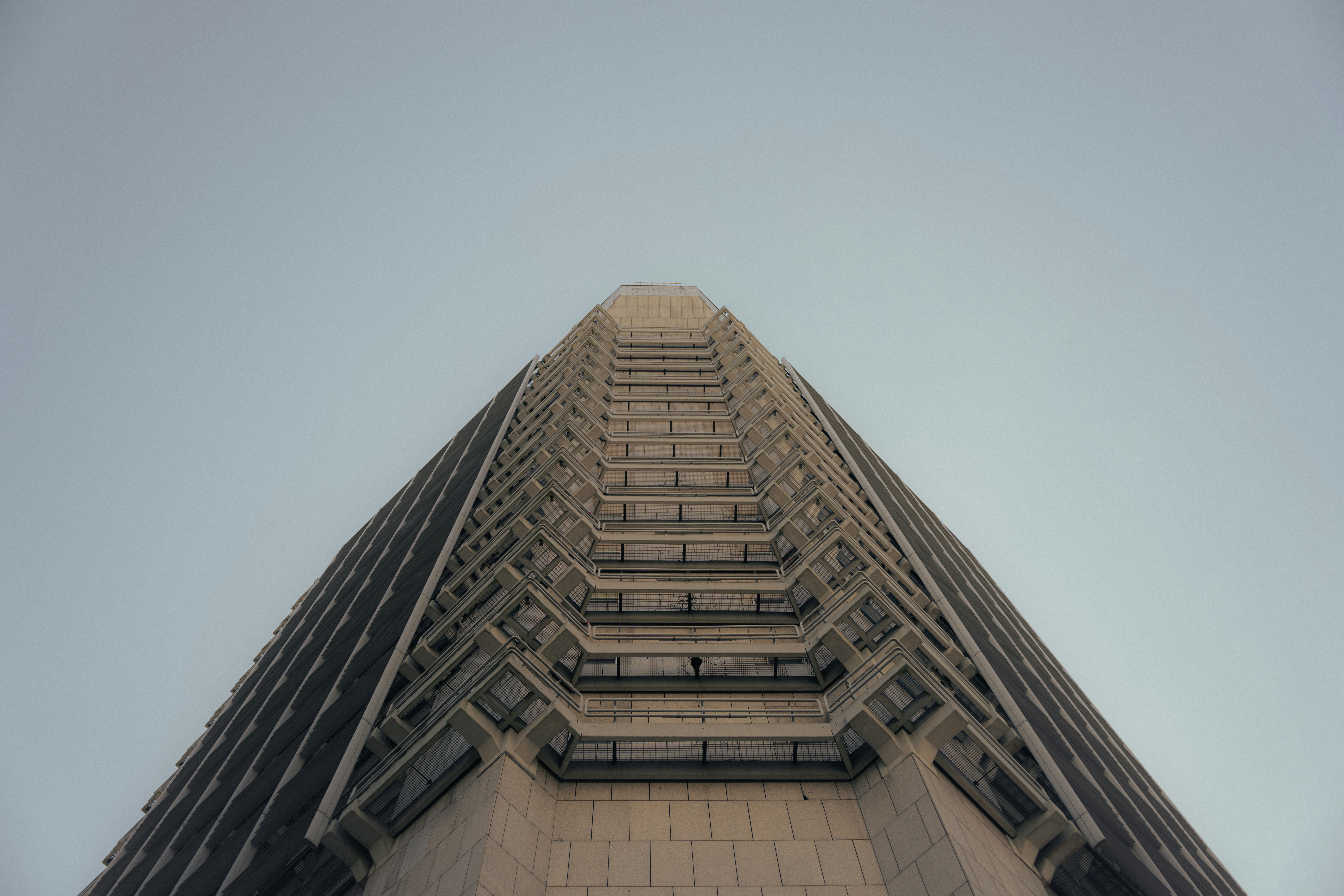 Ascension: A Concrete Monolith Climbing into a Clear Sky