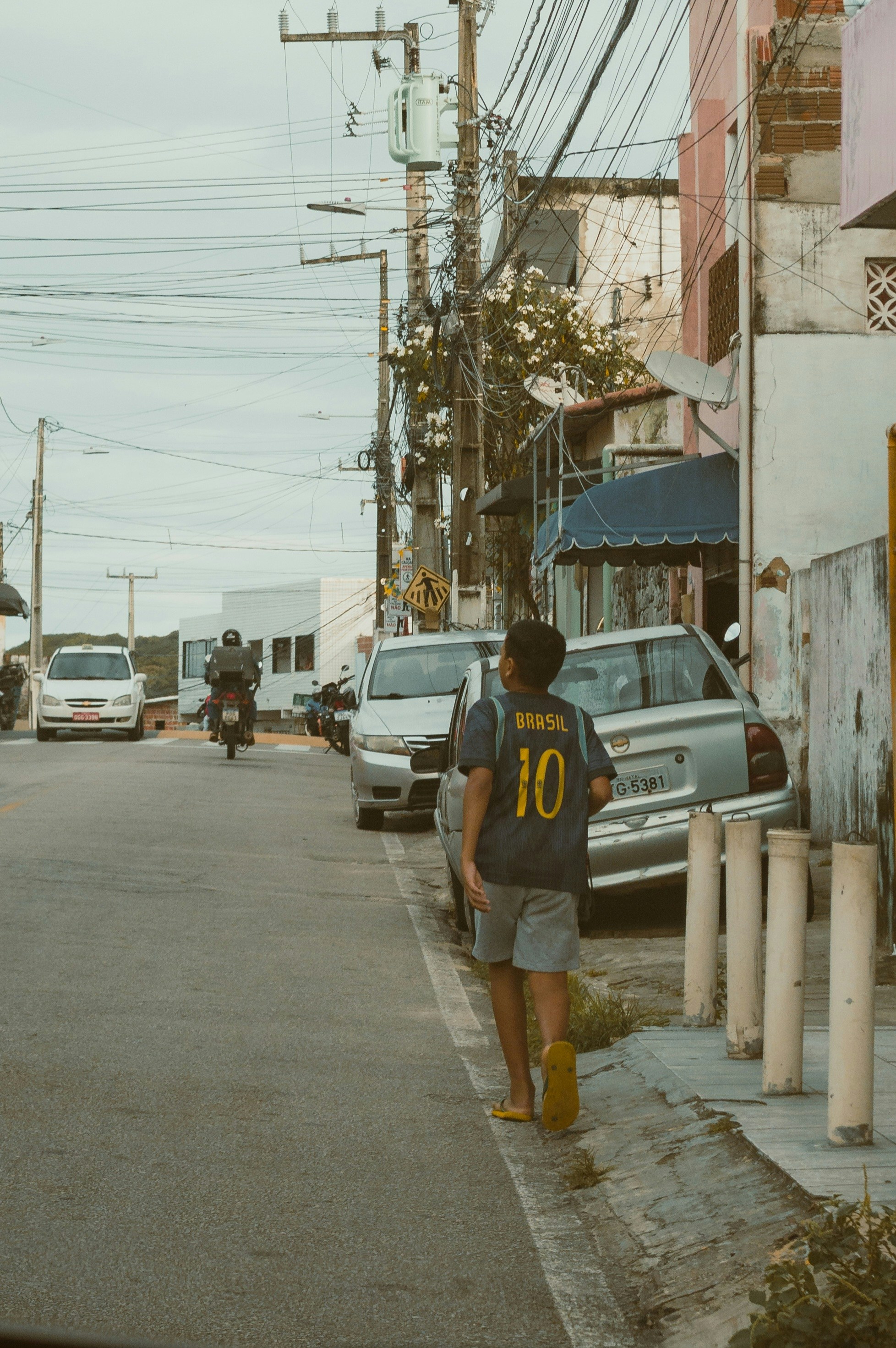 Across the Street: A Boy in a Backward Glance