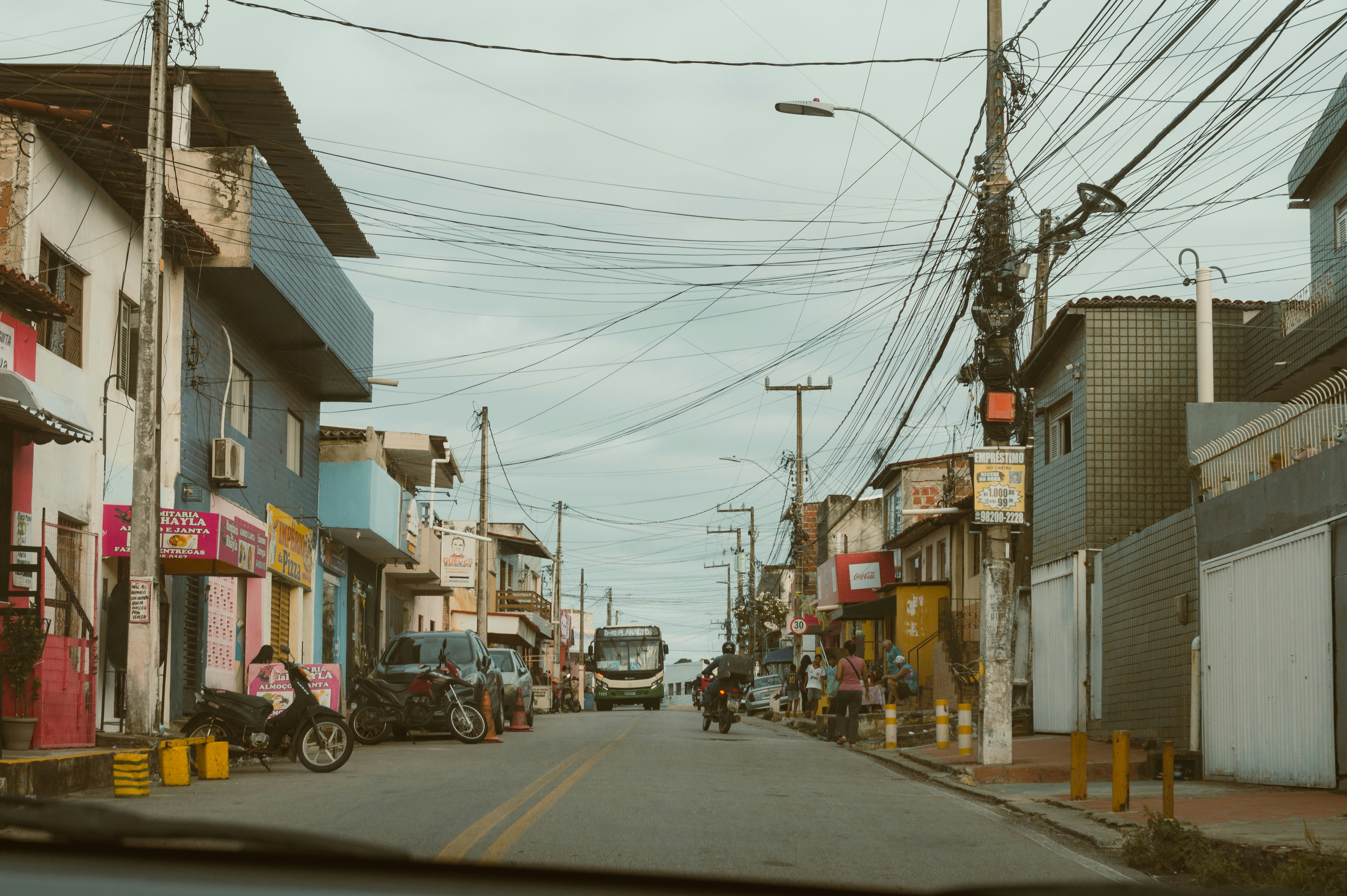Street in Focus: A Quiet Corridor Between Shops