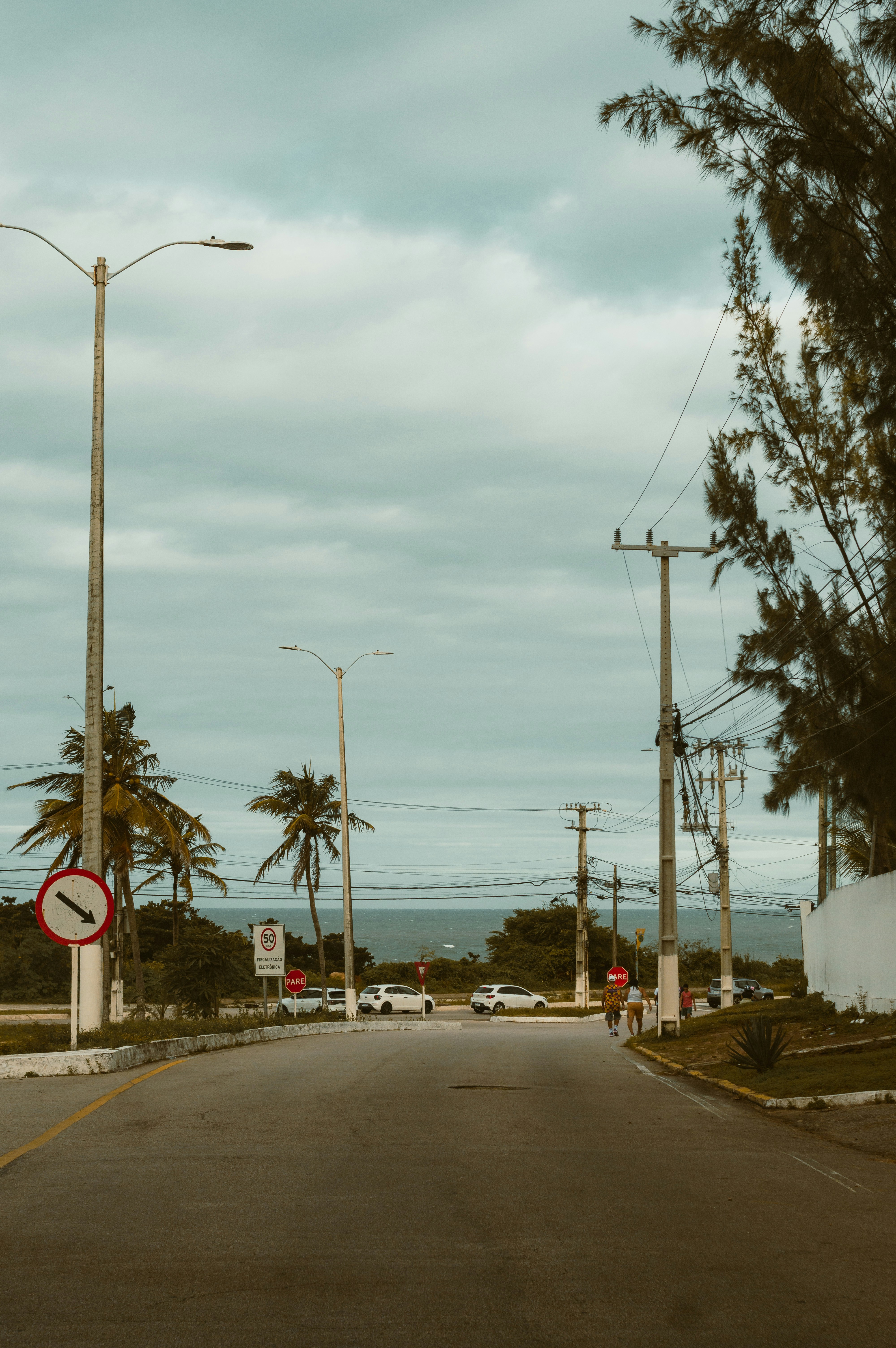 Coastal Avenue Convergence: Street, Sky, and Sea