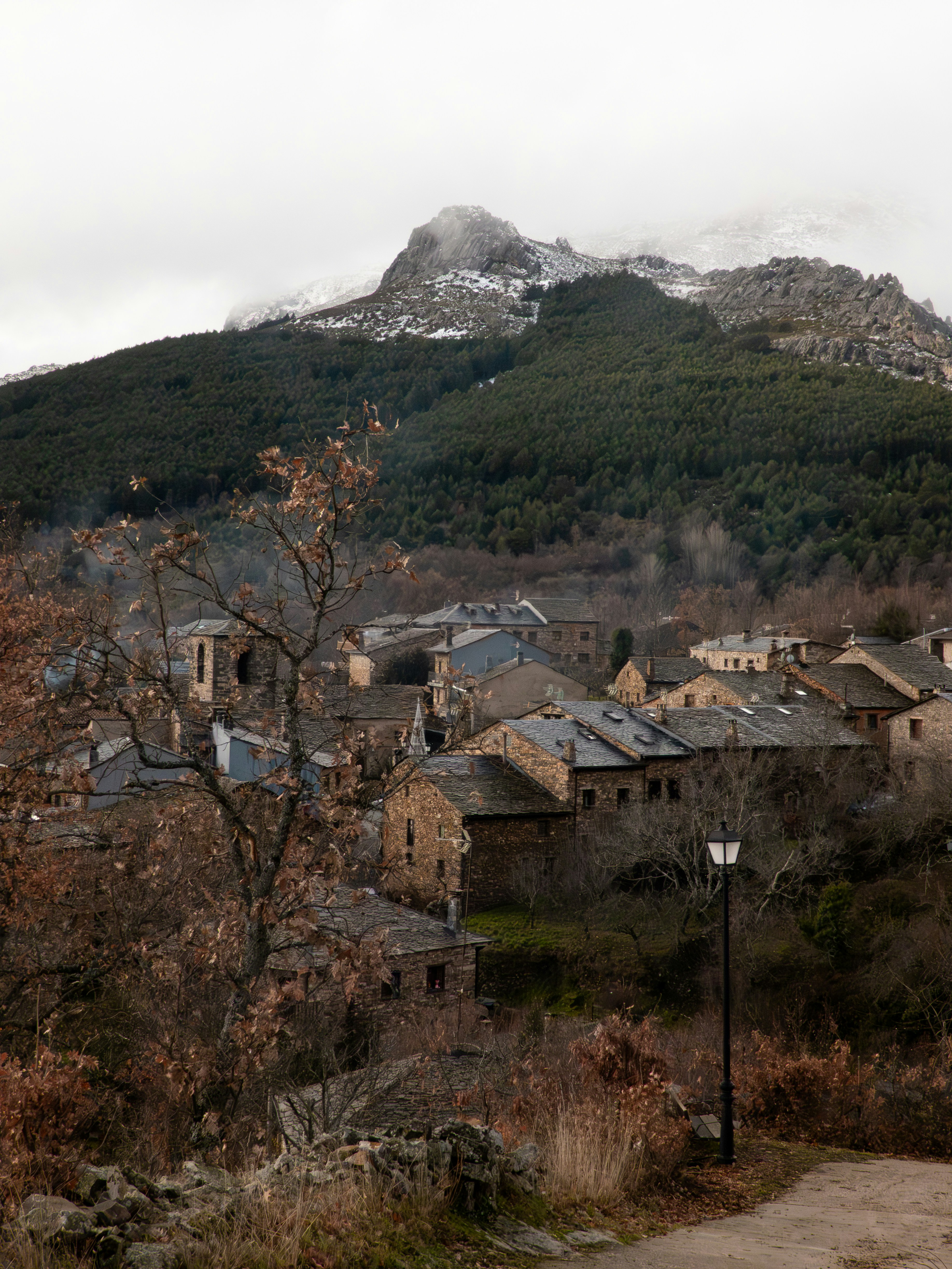 Stone Village Quiet Under Snow-kissed Ridge