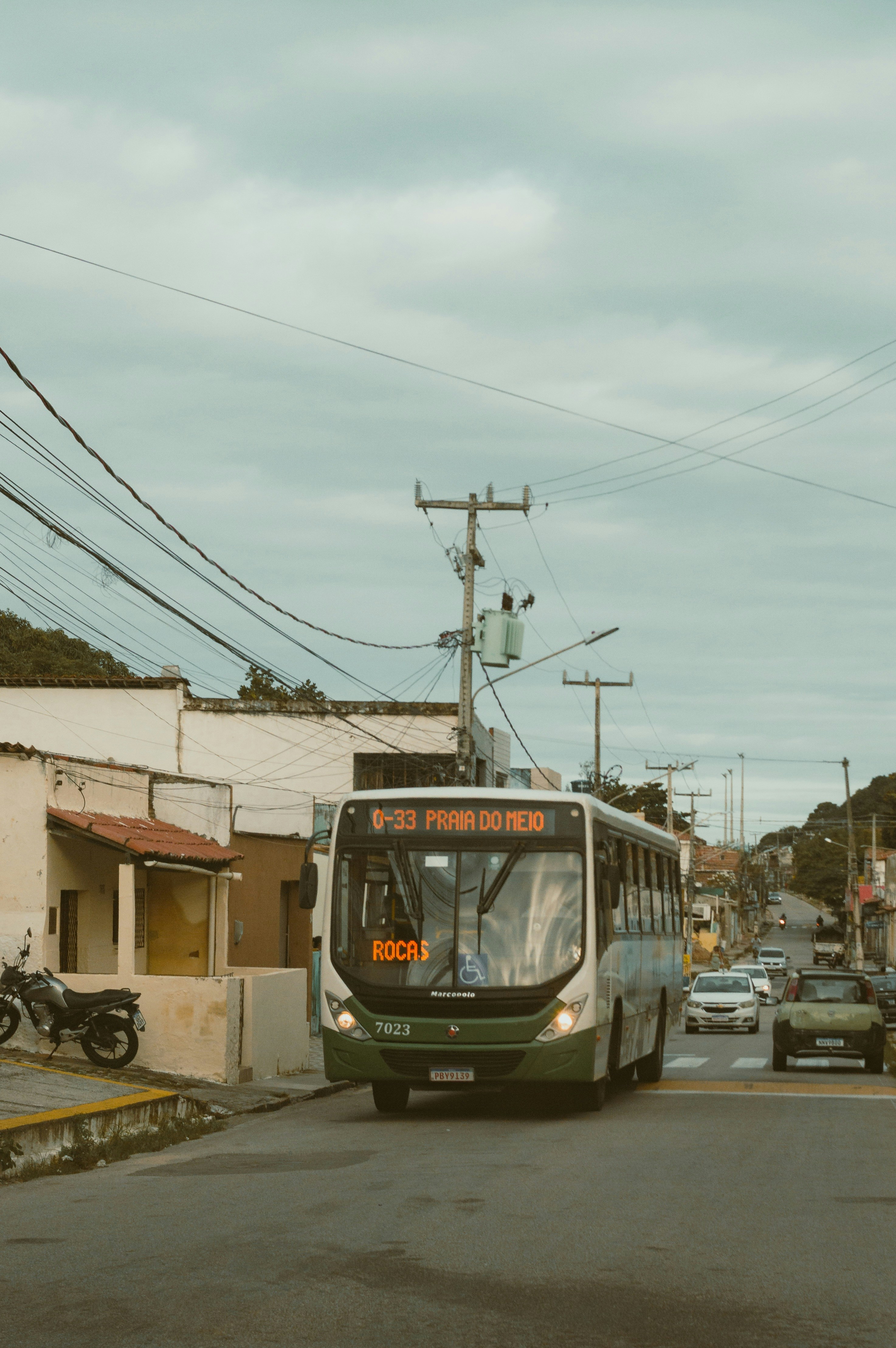 City Bus in a Quiet Street: Momentum in a Coastal Town