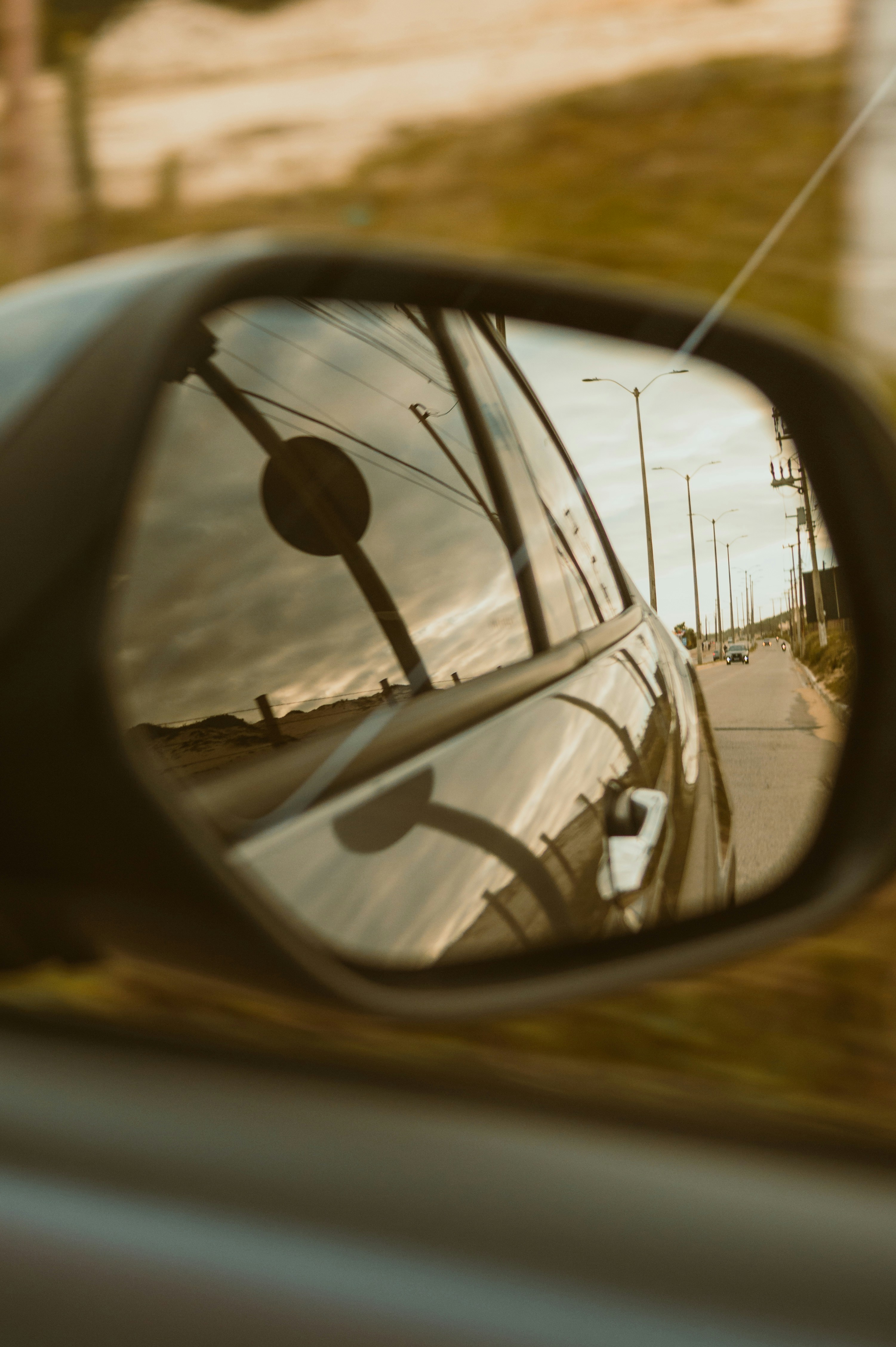 Rear-View Mirror Echoes: Street and Sign Reflections in a Moving Drive