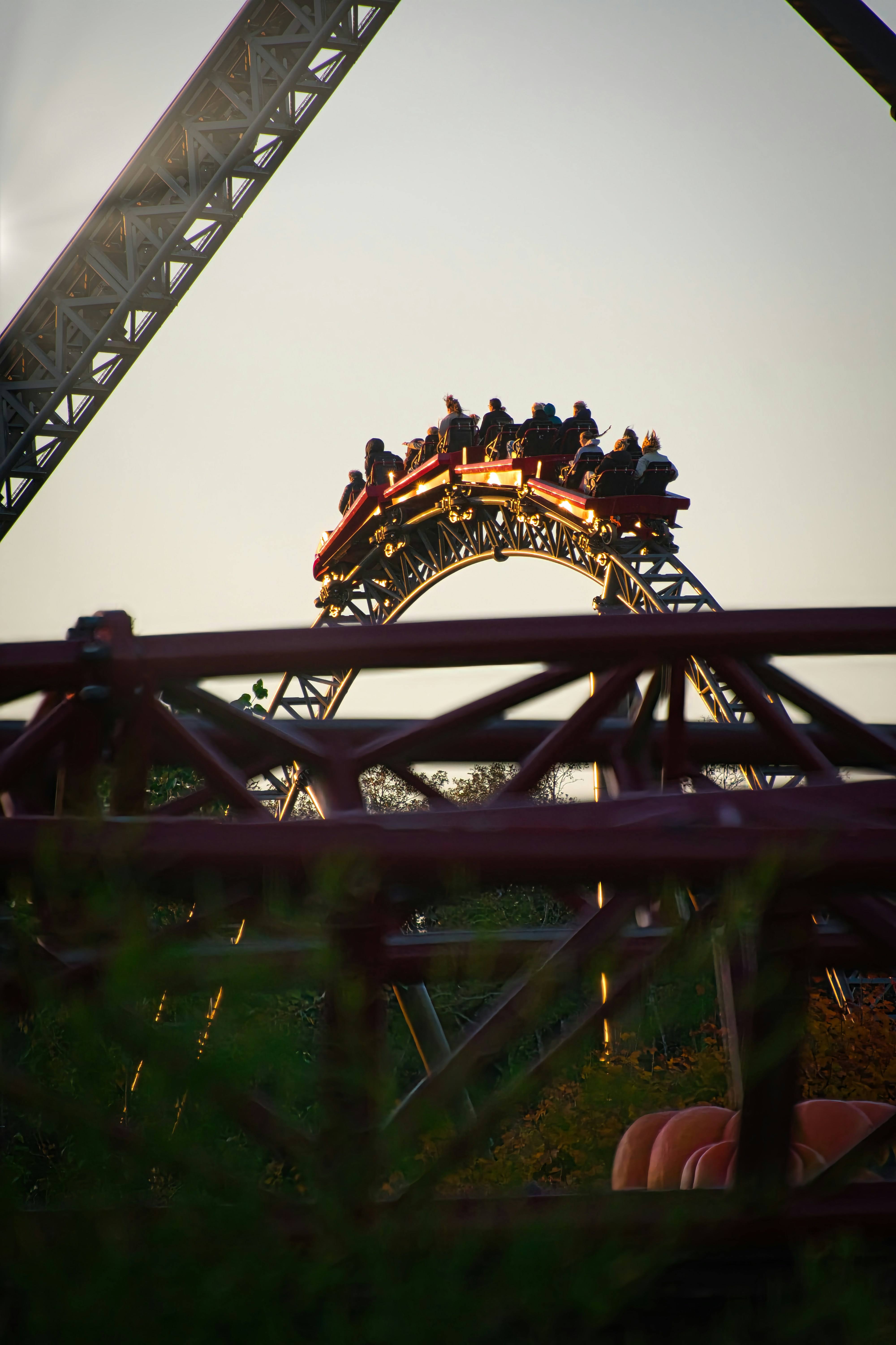 Riders Crest the Arc: A Tilted View of a Roller Coaster Loop