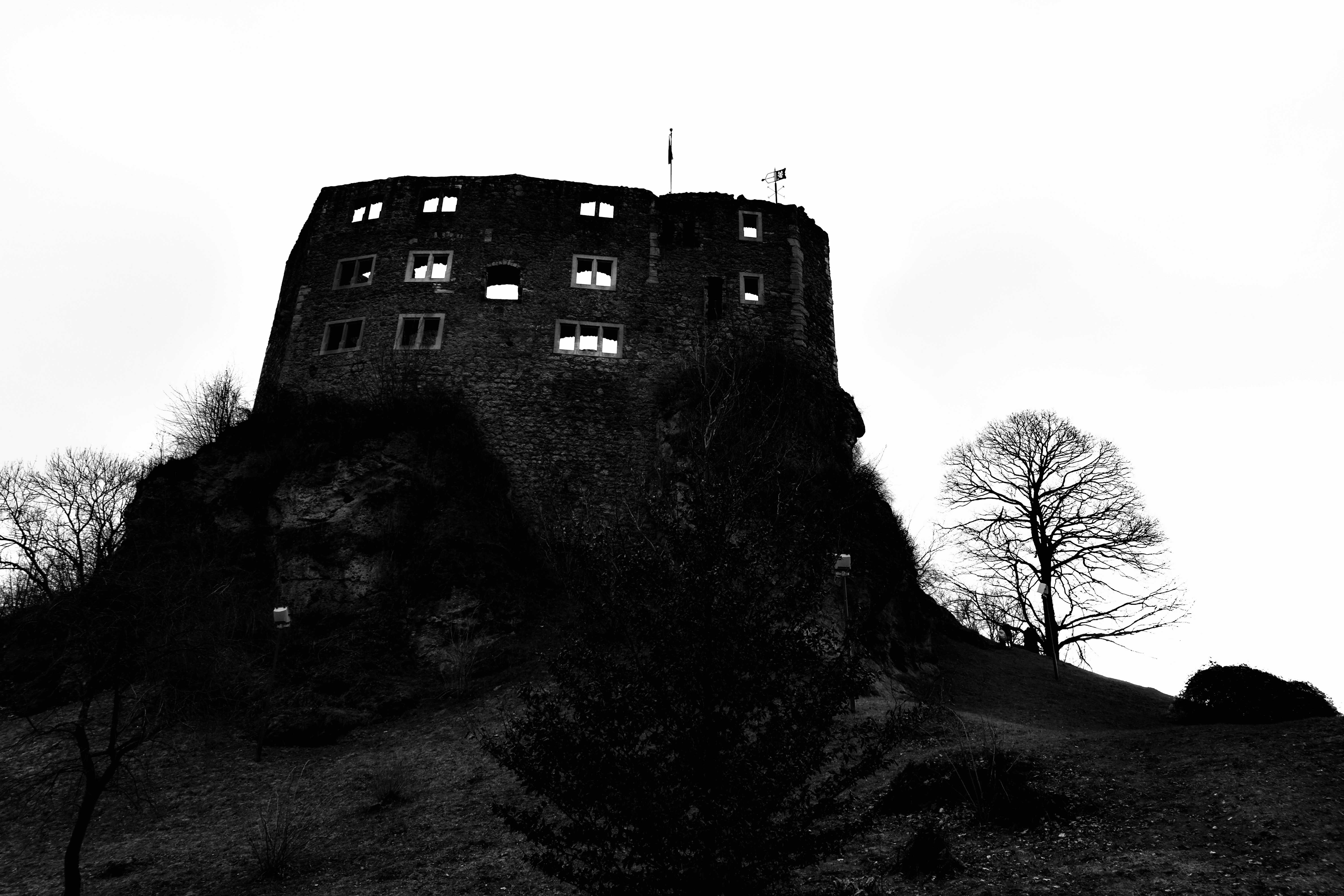 Castle on the Dark Hill: A Stark Silhouette Against the Sky