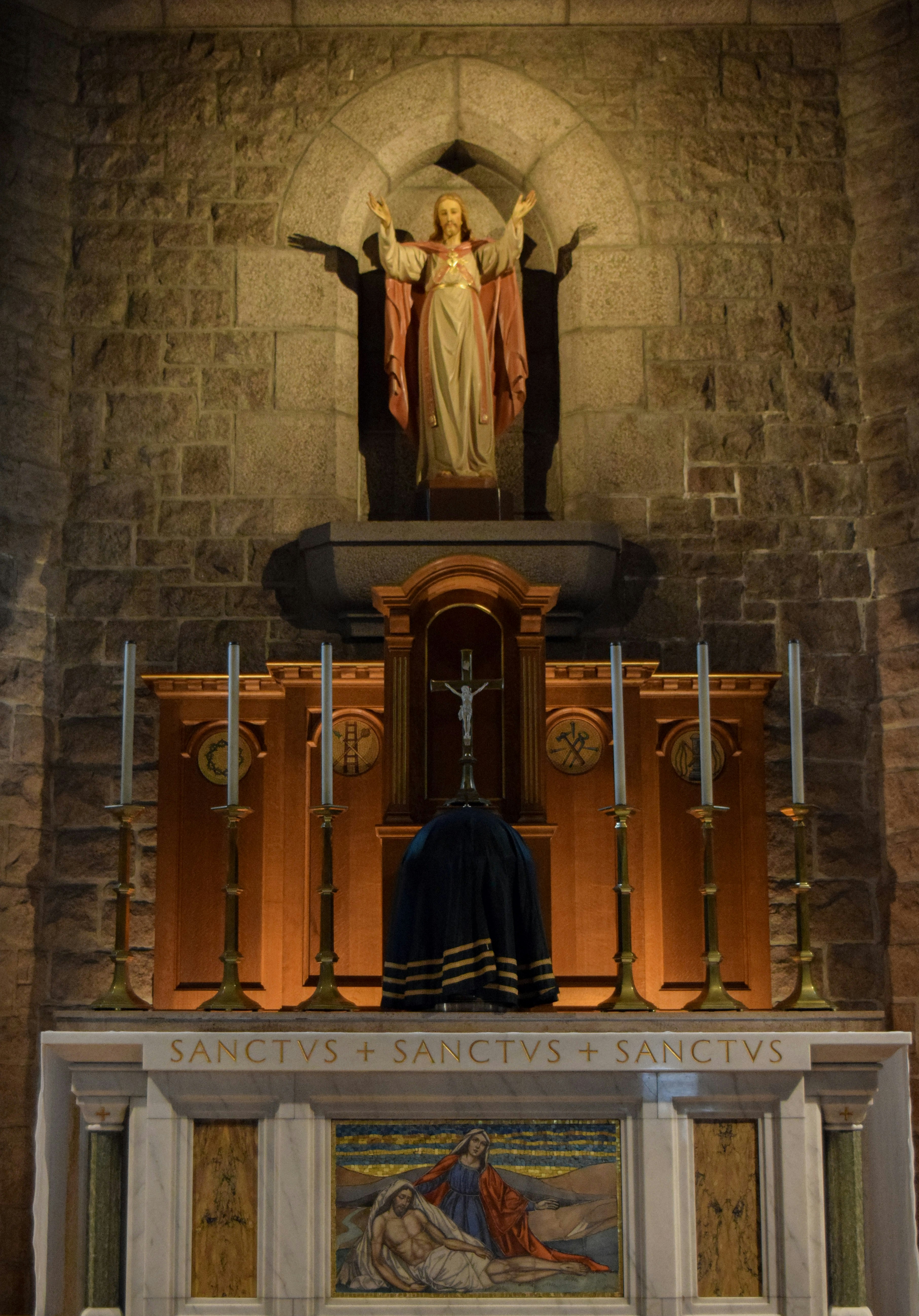 Risen Christ above a solemn altar beneath candlelit arches