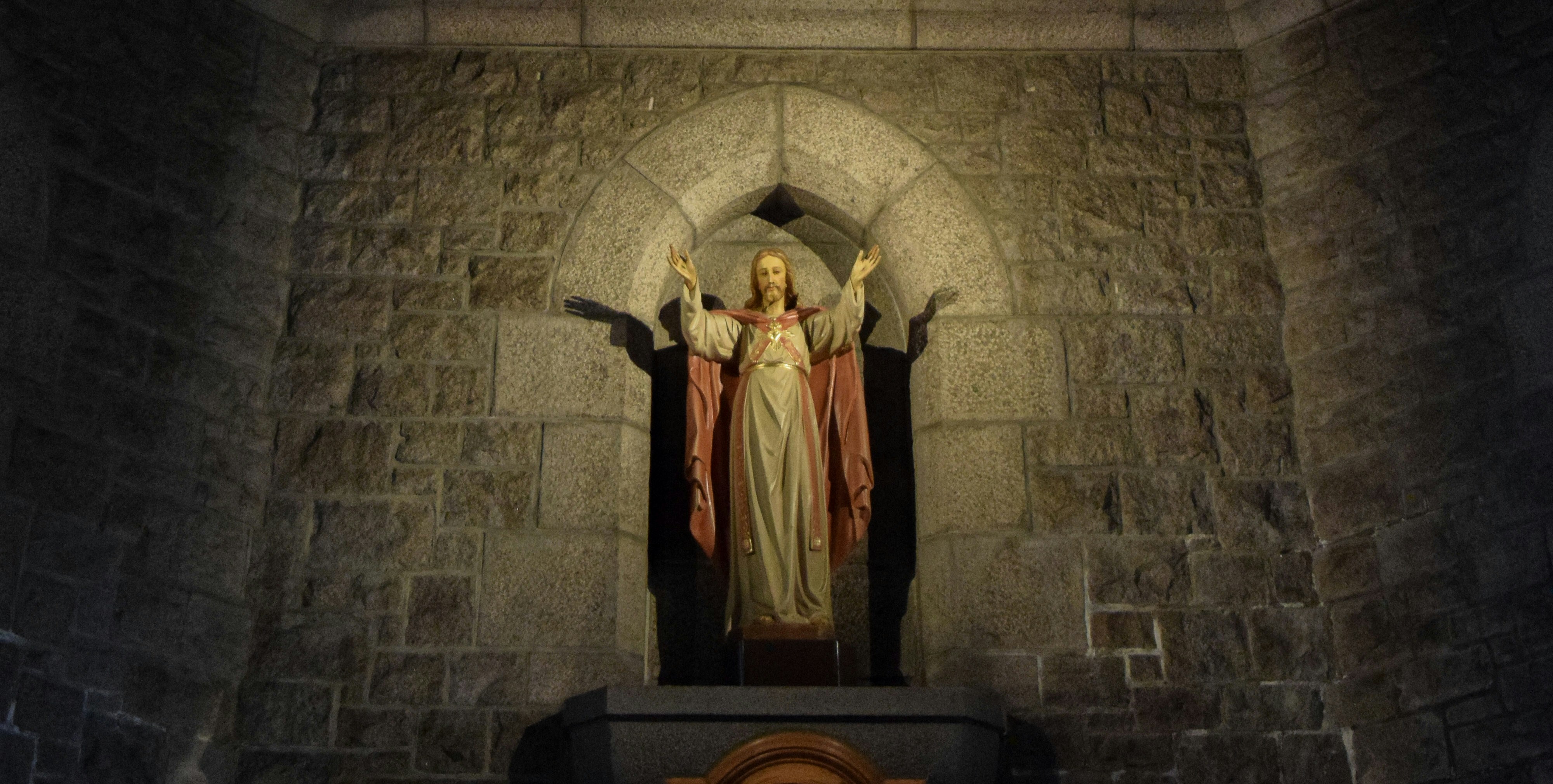 Haloed Figure in Stone Niche