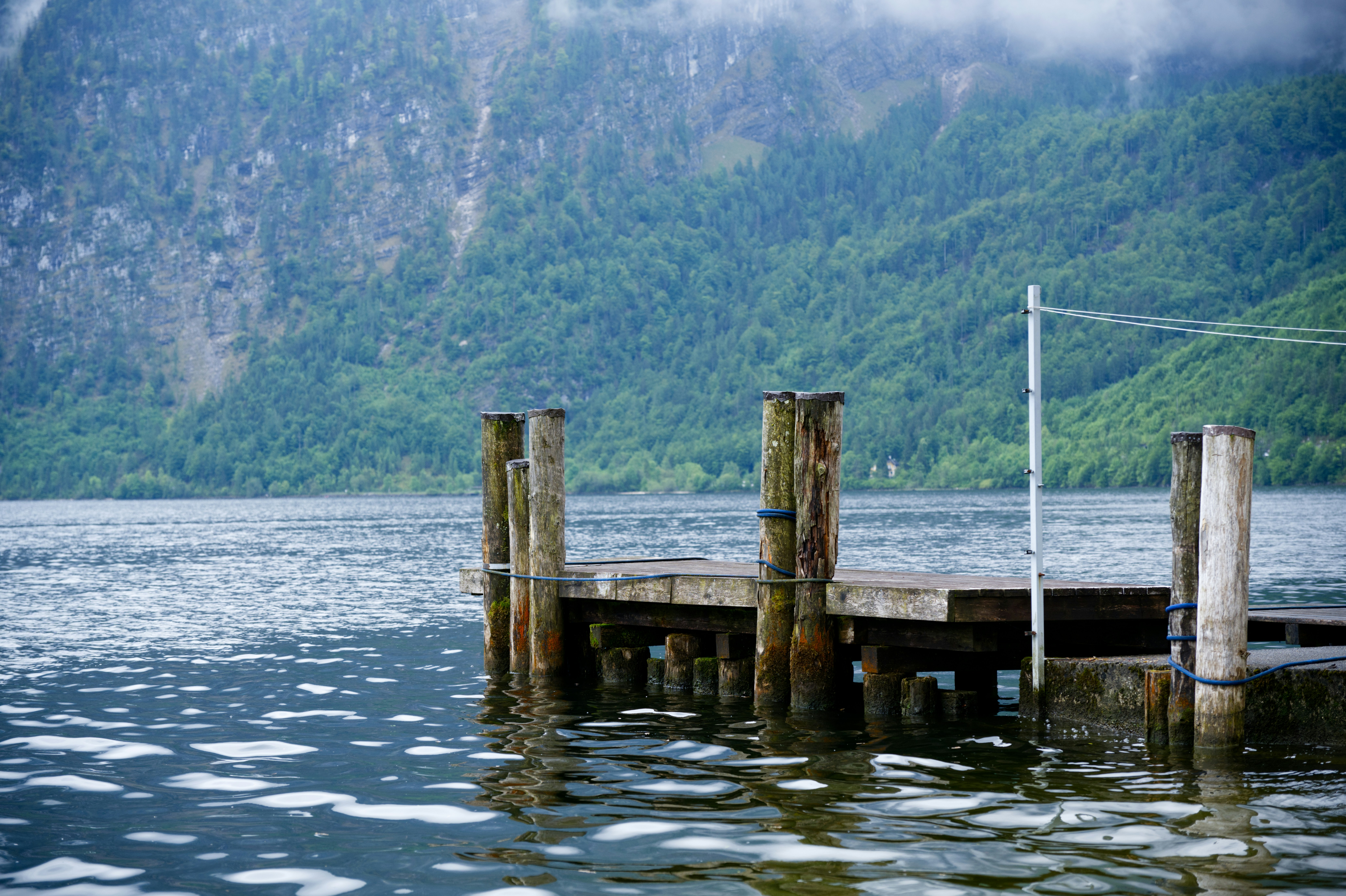 Weathered dock at a misty Nordic lake