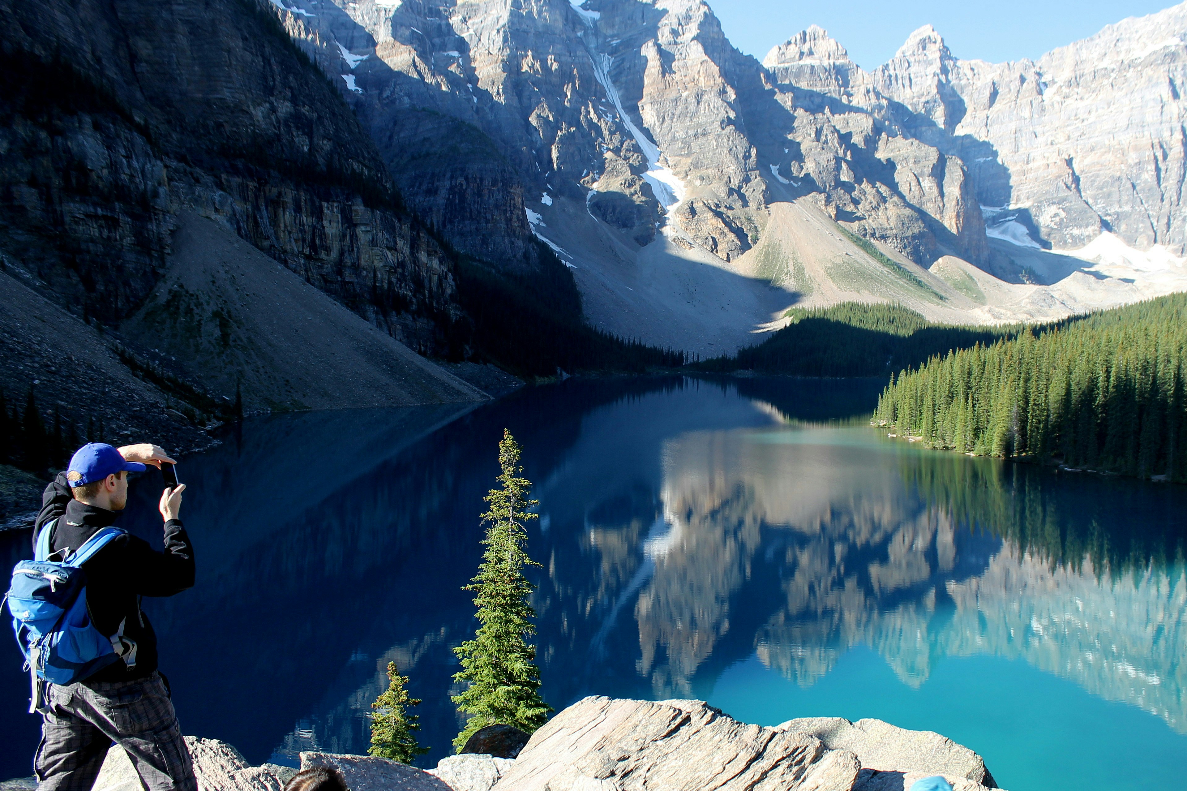 Azure Mirror: A Hiker Captures Moraine Lake's Quiet Majesty