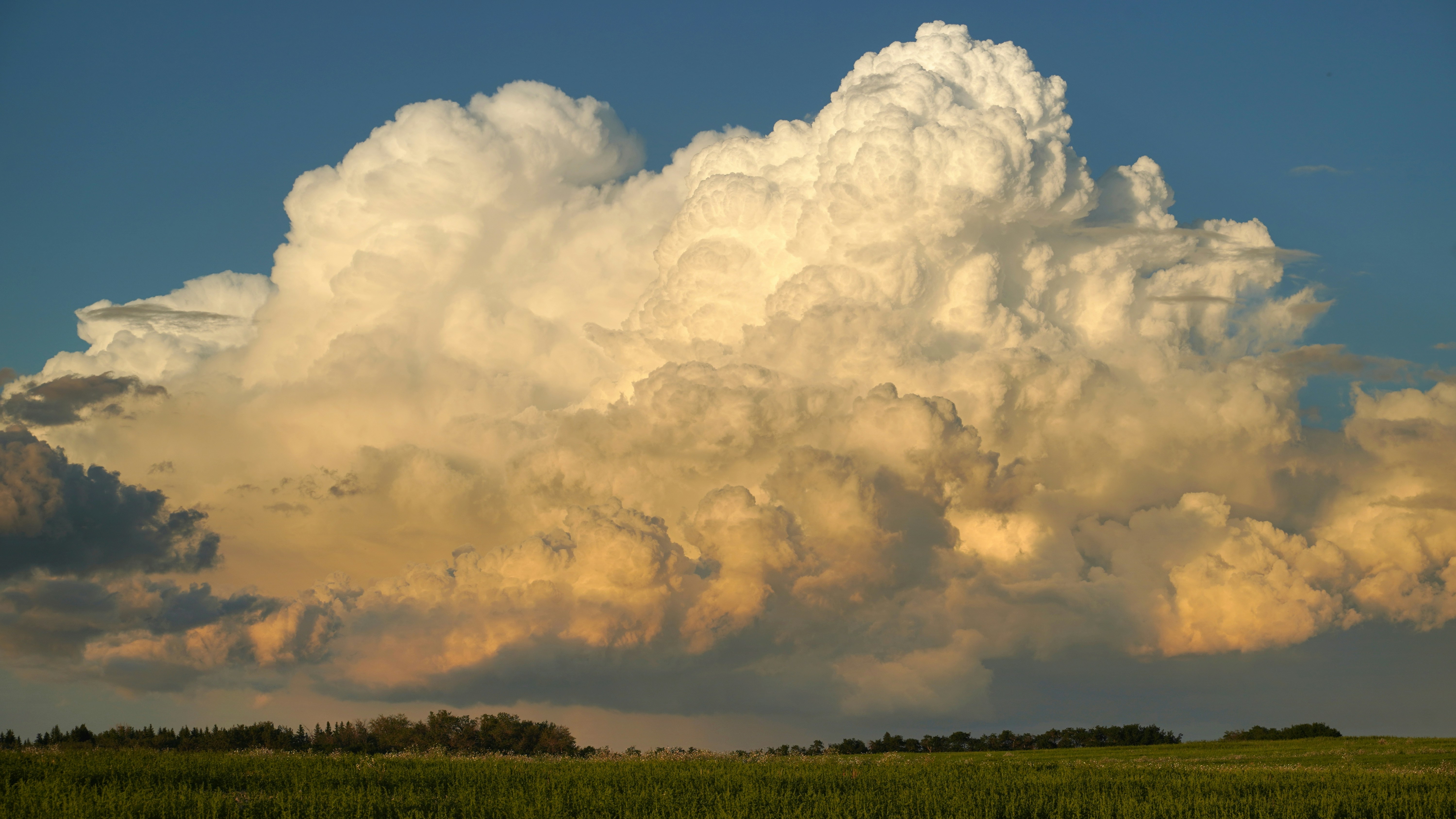 Massive storm rising above the countryside