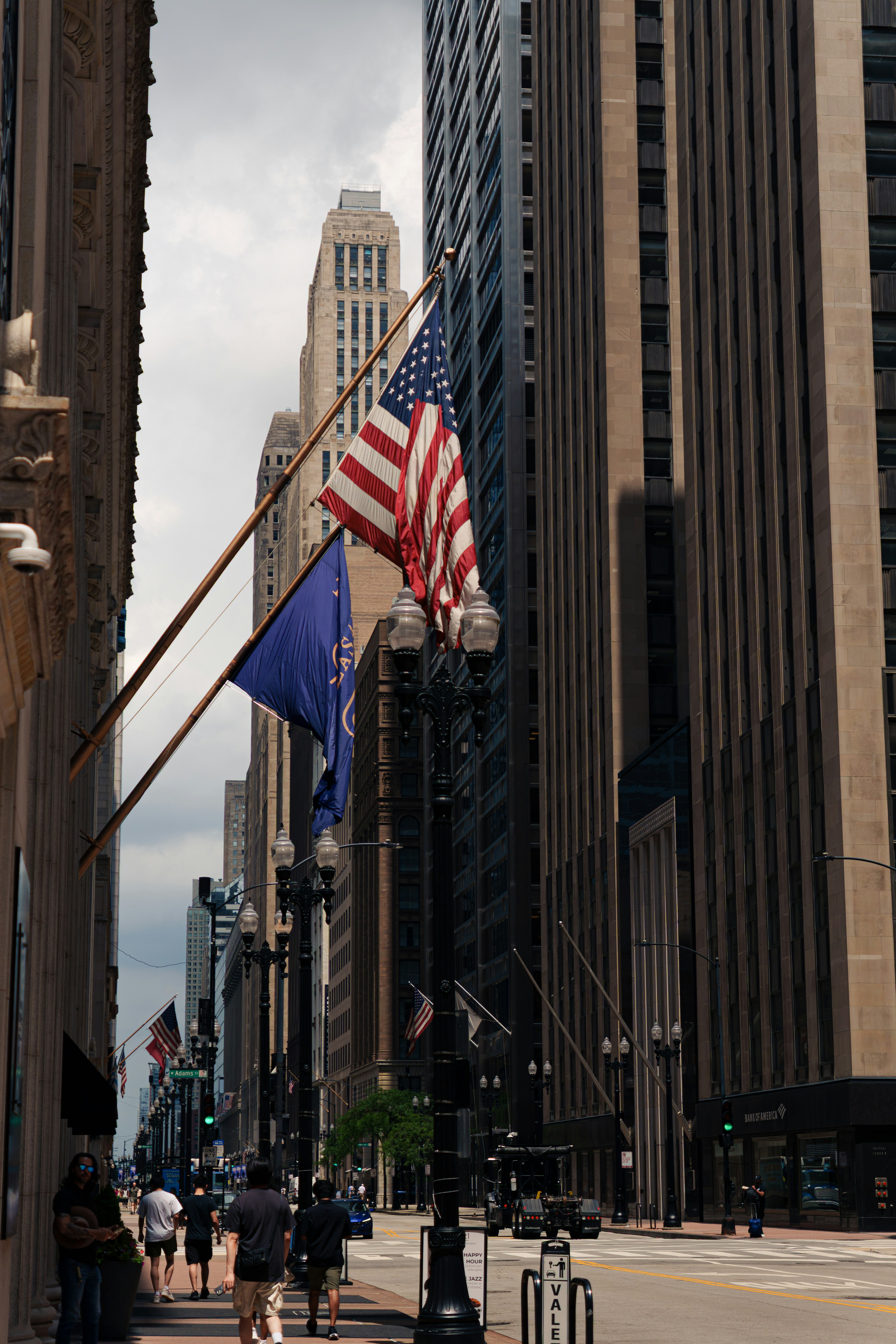 Flag-Bearing Street in a Canyon of Skyscrapers