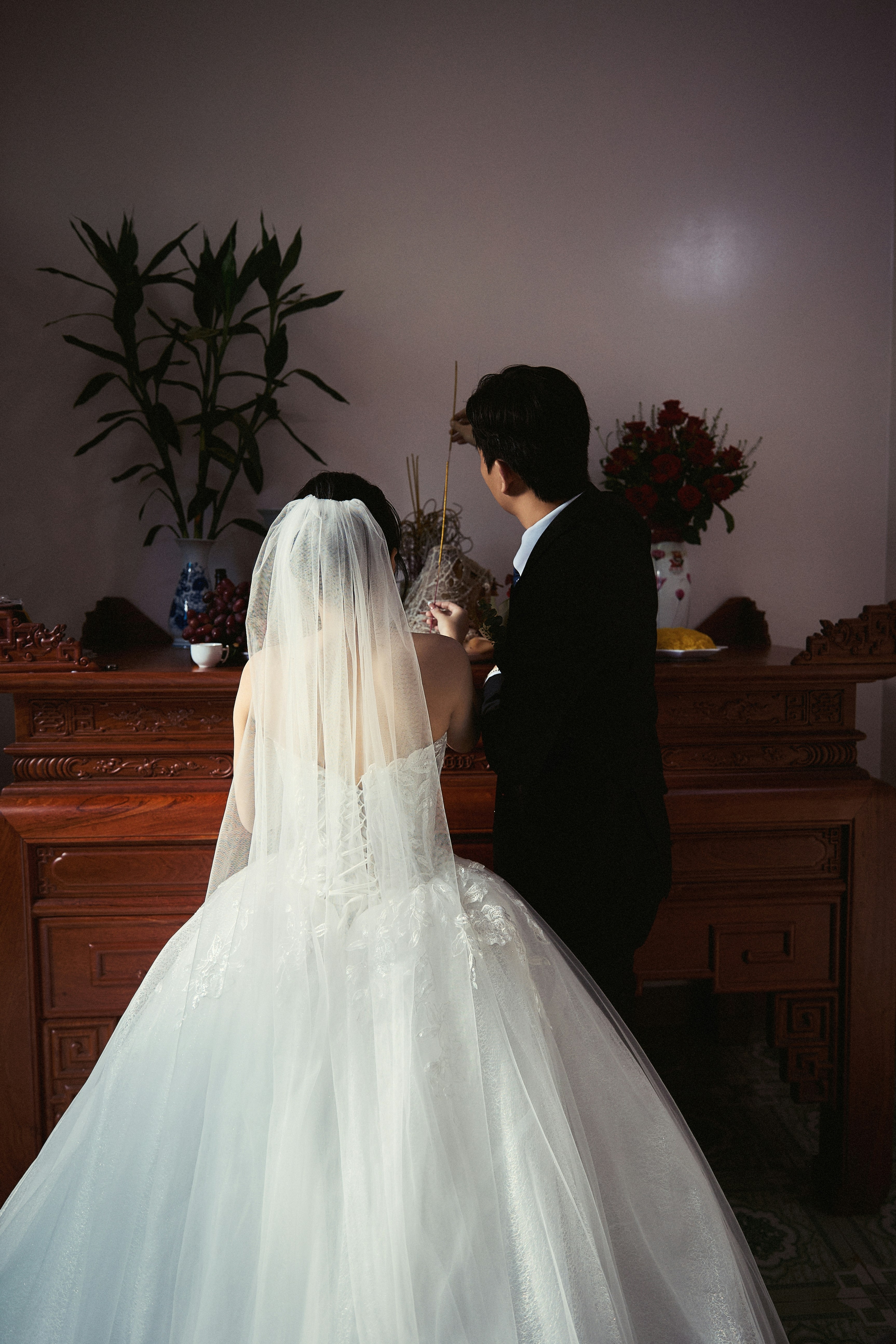  vows and velvet: a couple at the ceremonial altar