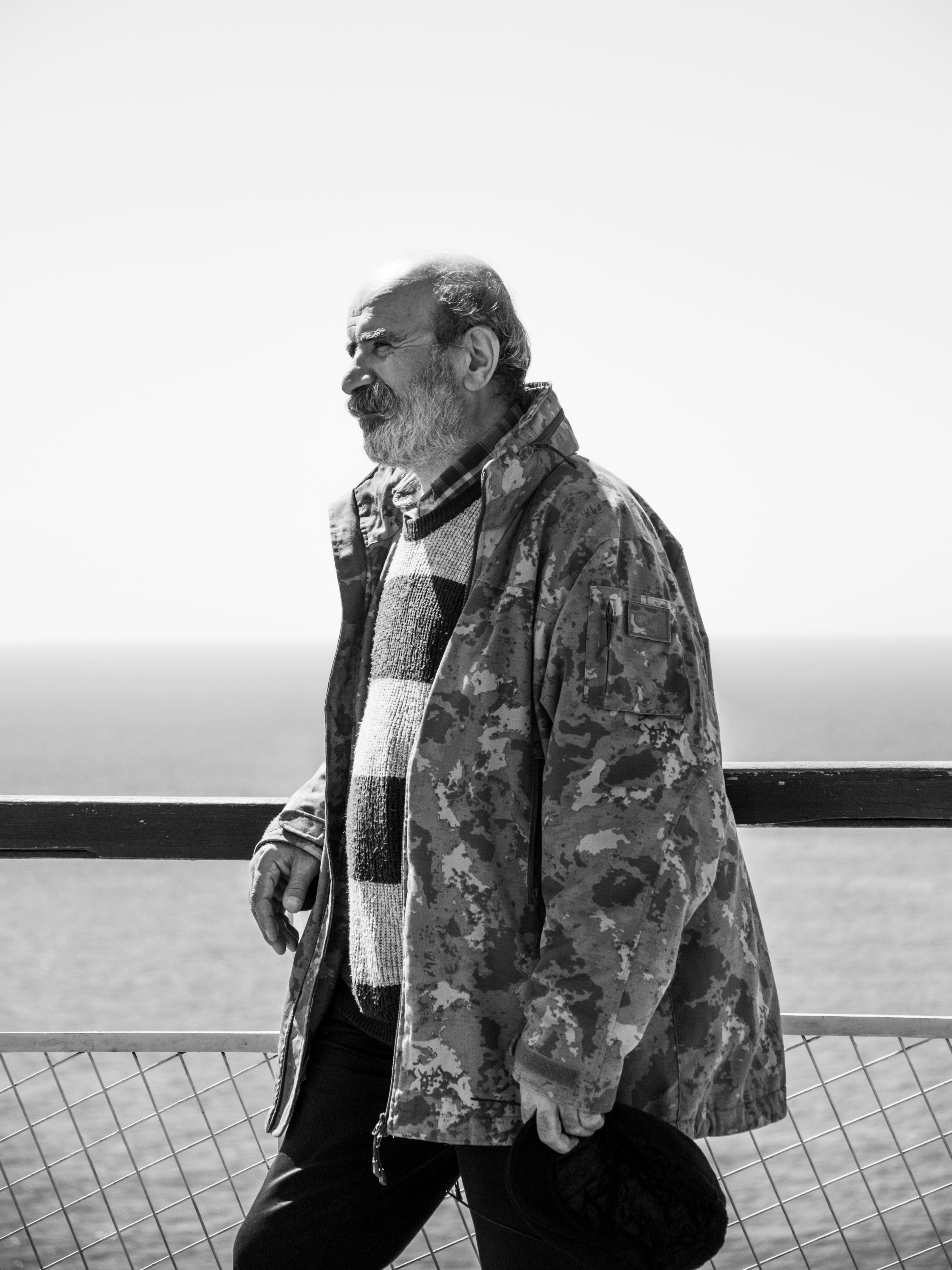 Sea-Edge Witness: A Weathered Traveler in Camouflage