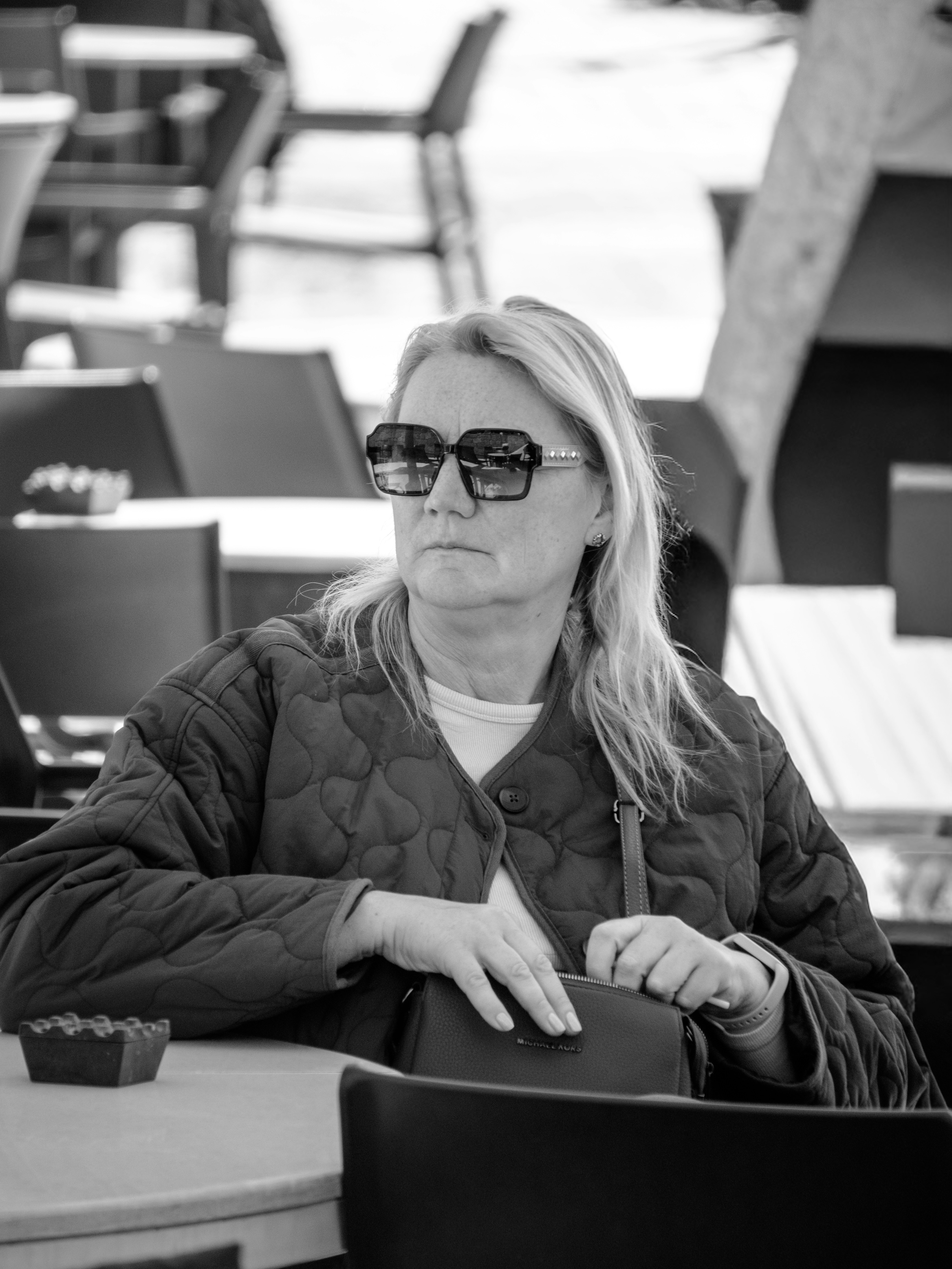 Chic Contemplation Under Sunglasses