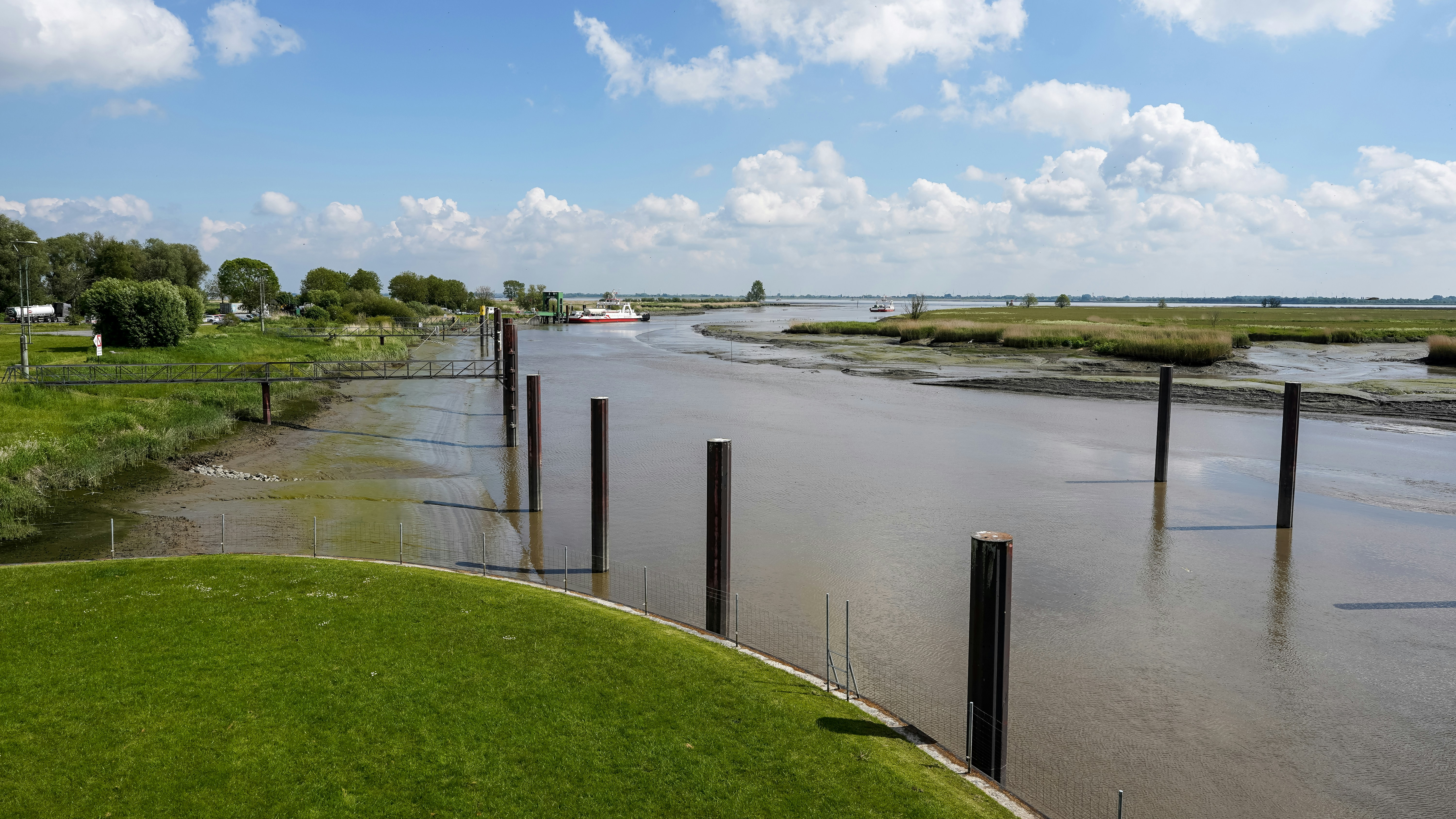 River Channel Docks: Distant Boat and Pastoral Waterfront