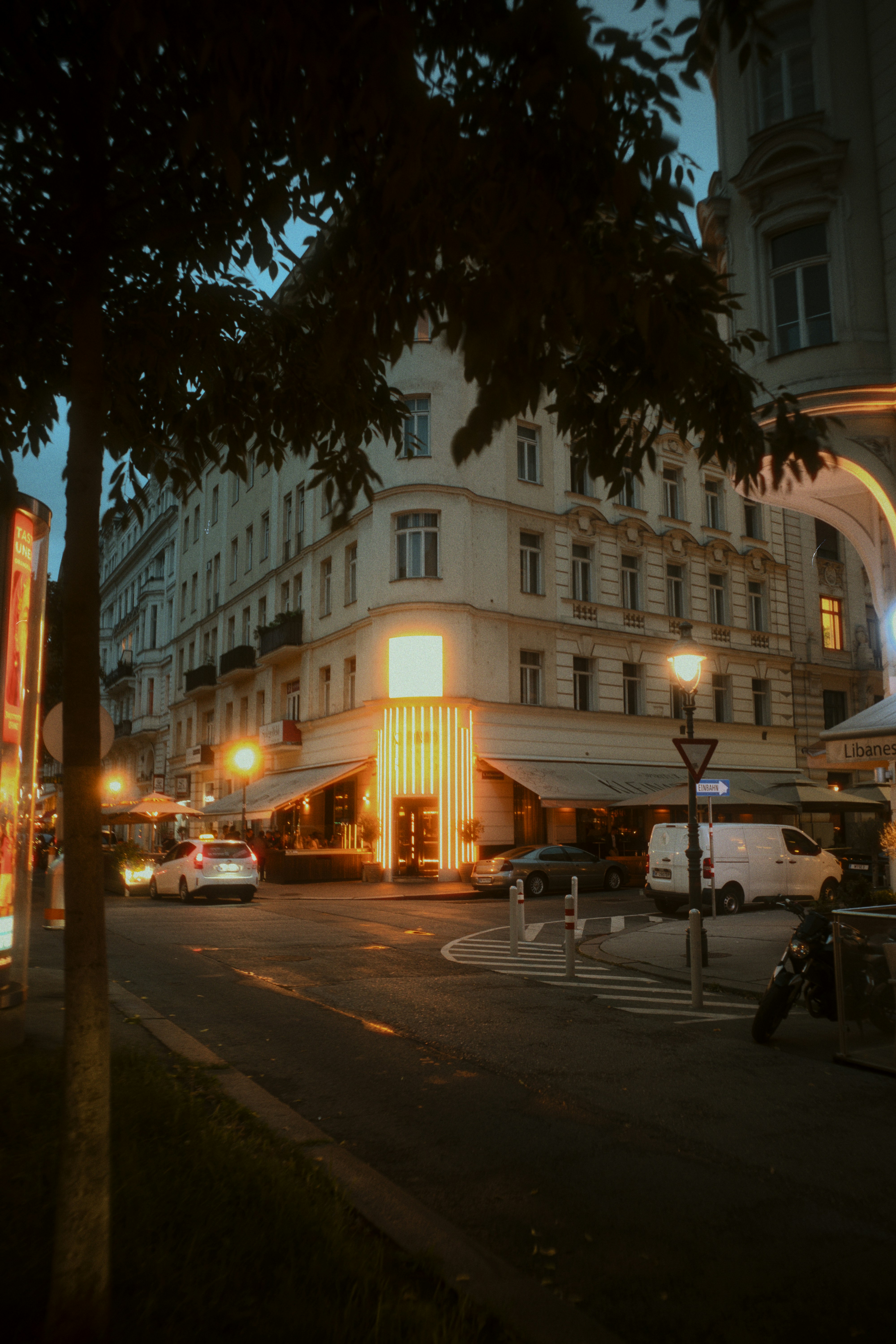 Warm Neon Glow on a Parisian Corner