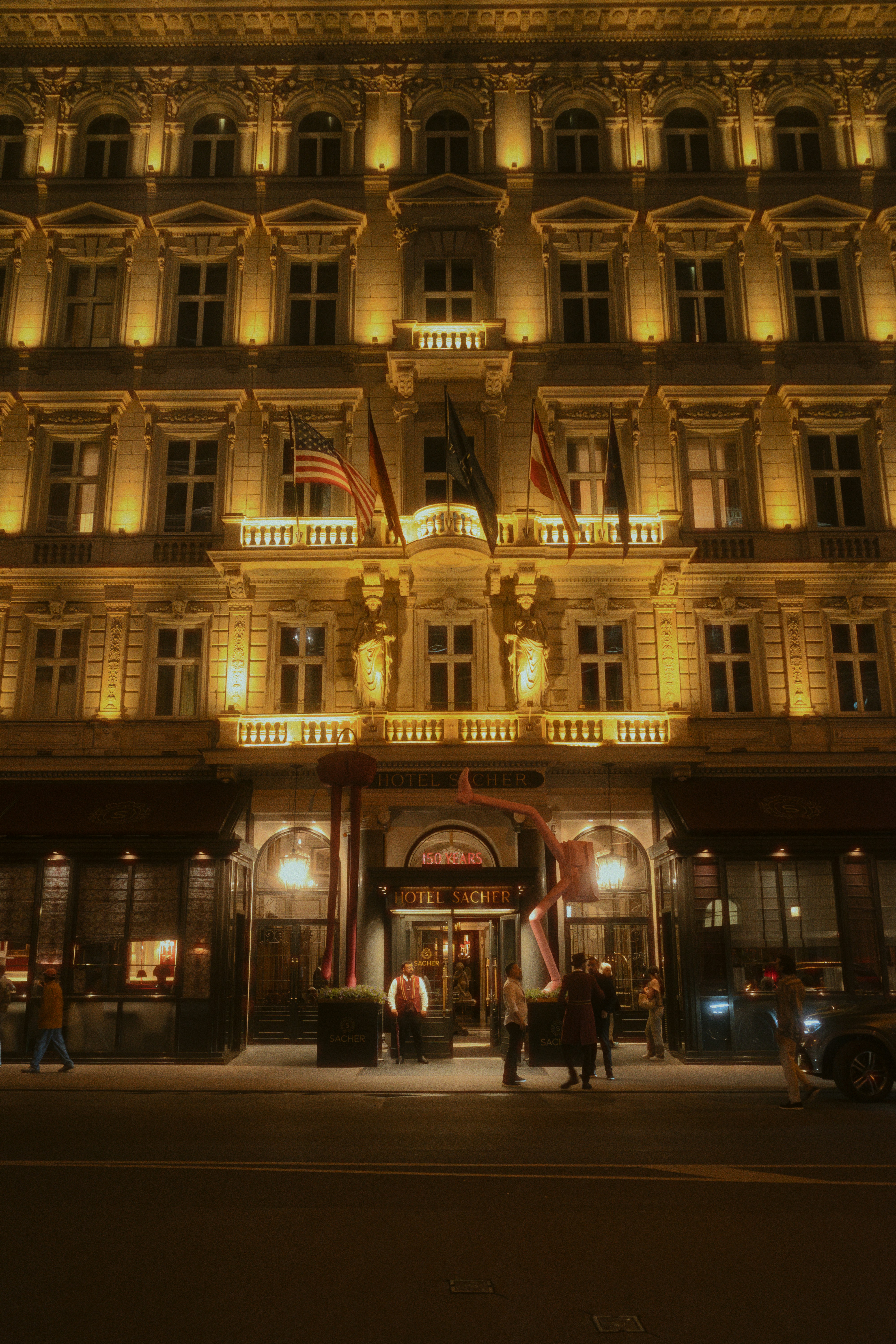 Illuminated Facade: Nighttime Grandeur of a Grand Hotel Entrance