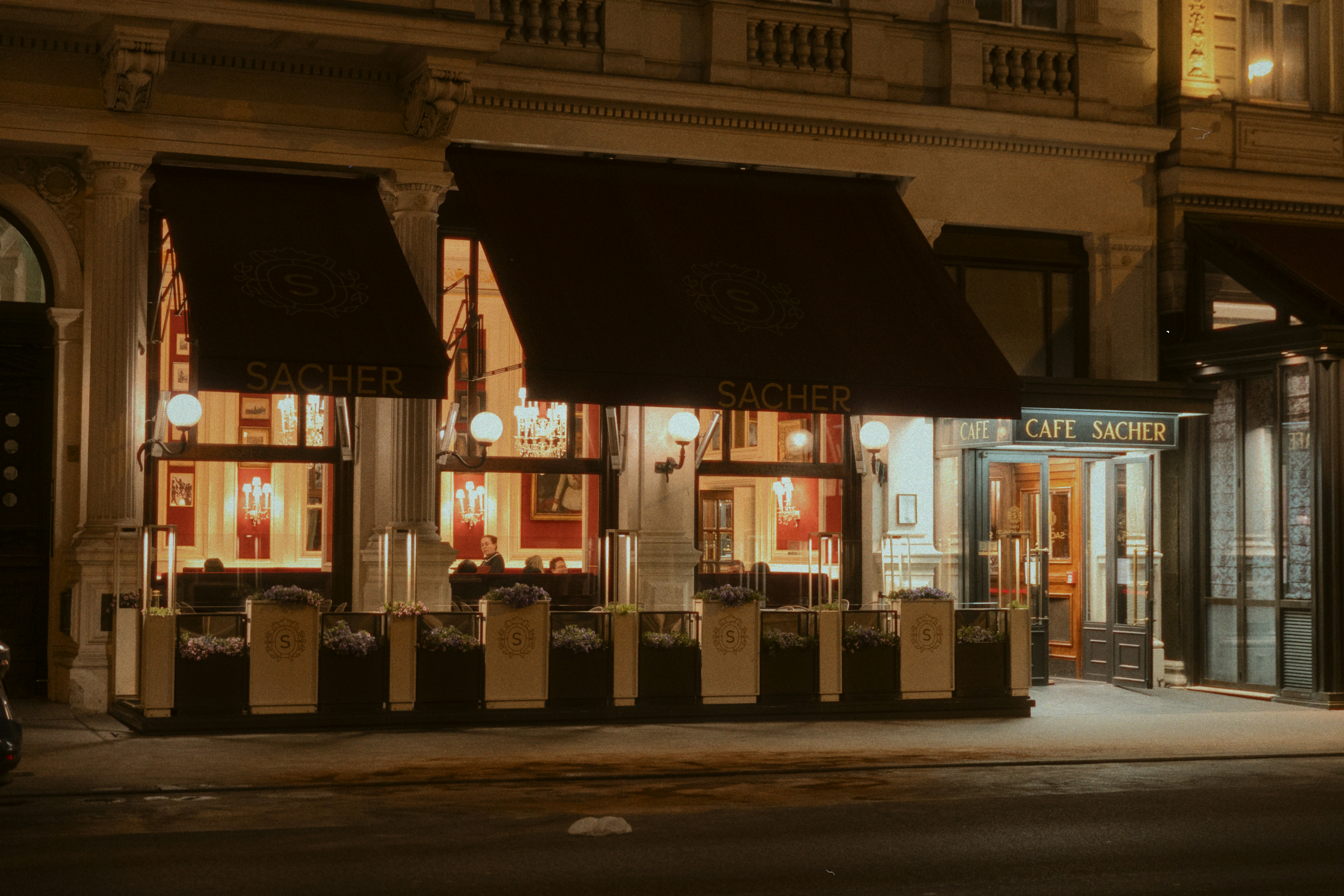 Warm Glow on a Parisian Café Street at Night