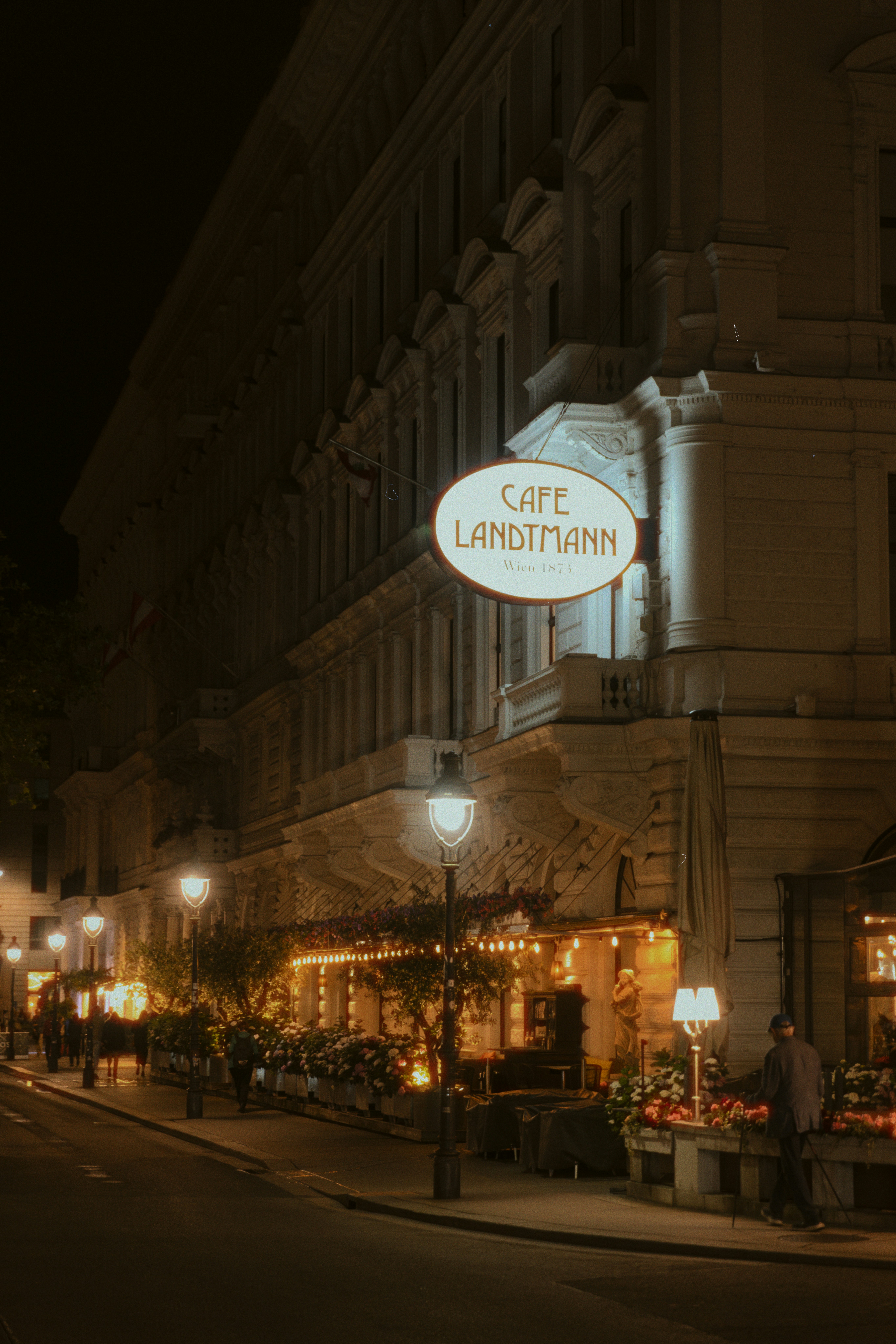 Café Landmark: Warm Night Glow on a Historic Street