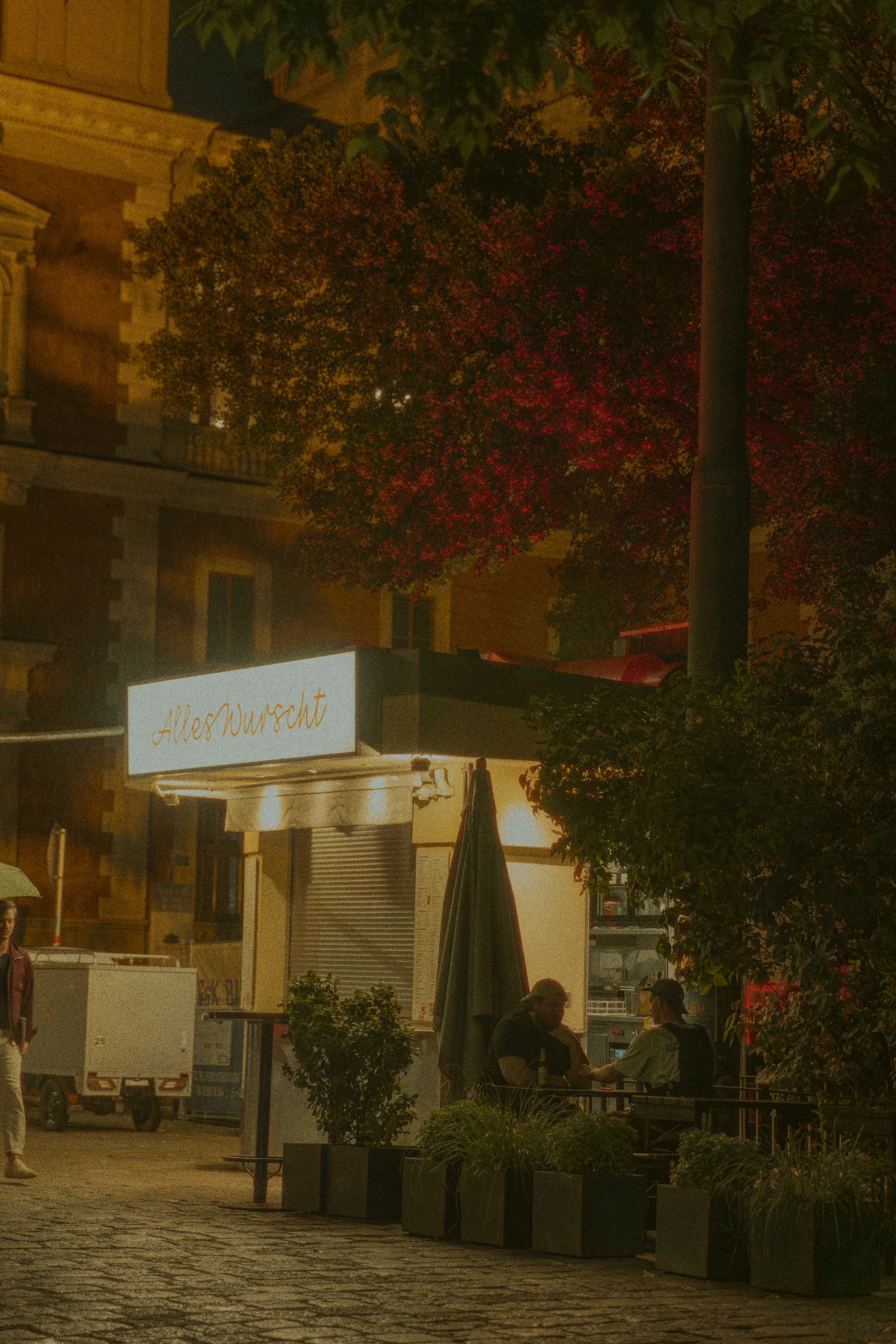 Night cafe under amber glow: a quiet street scene
