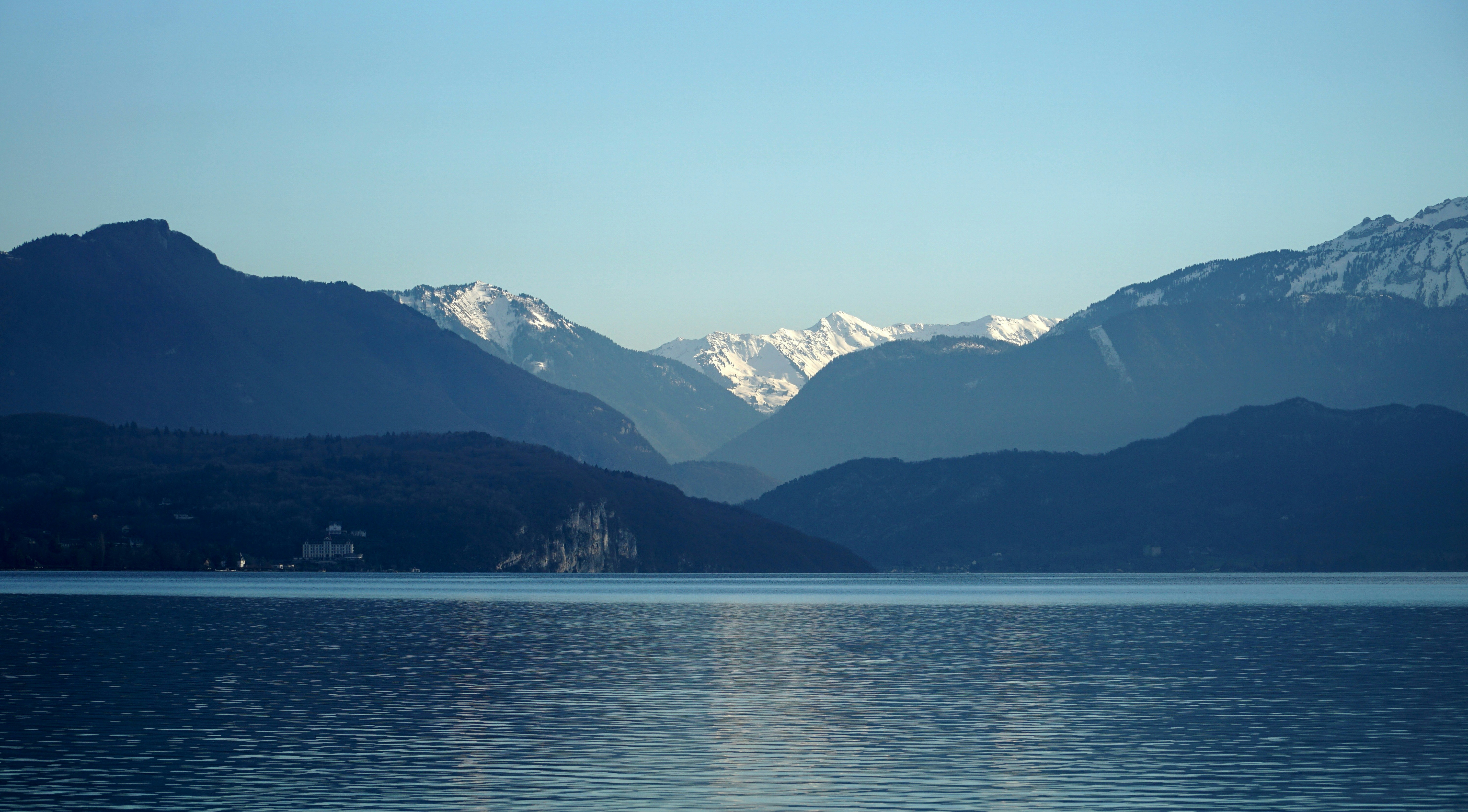 Mirror of Peaks Across a Tranquil Fjord