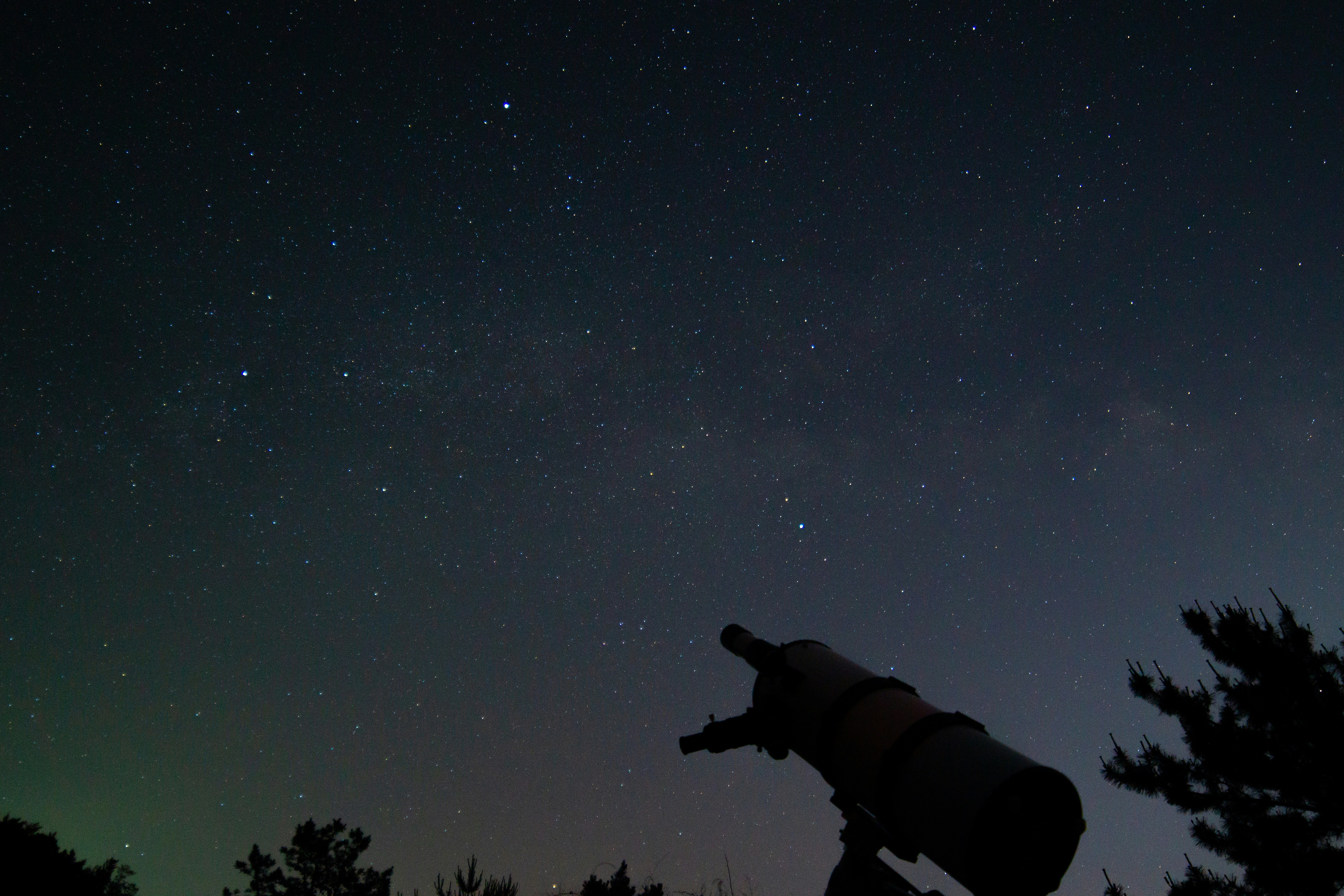 Telescope Silhouette Under a Starry Dusk