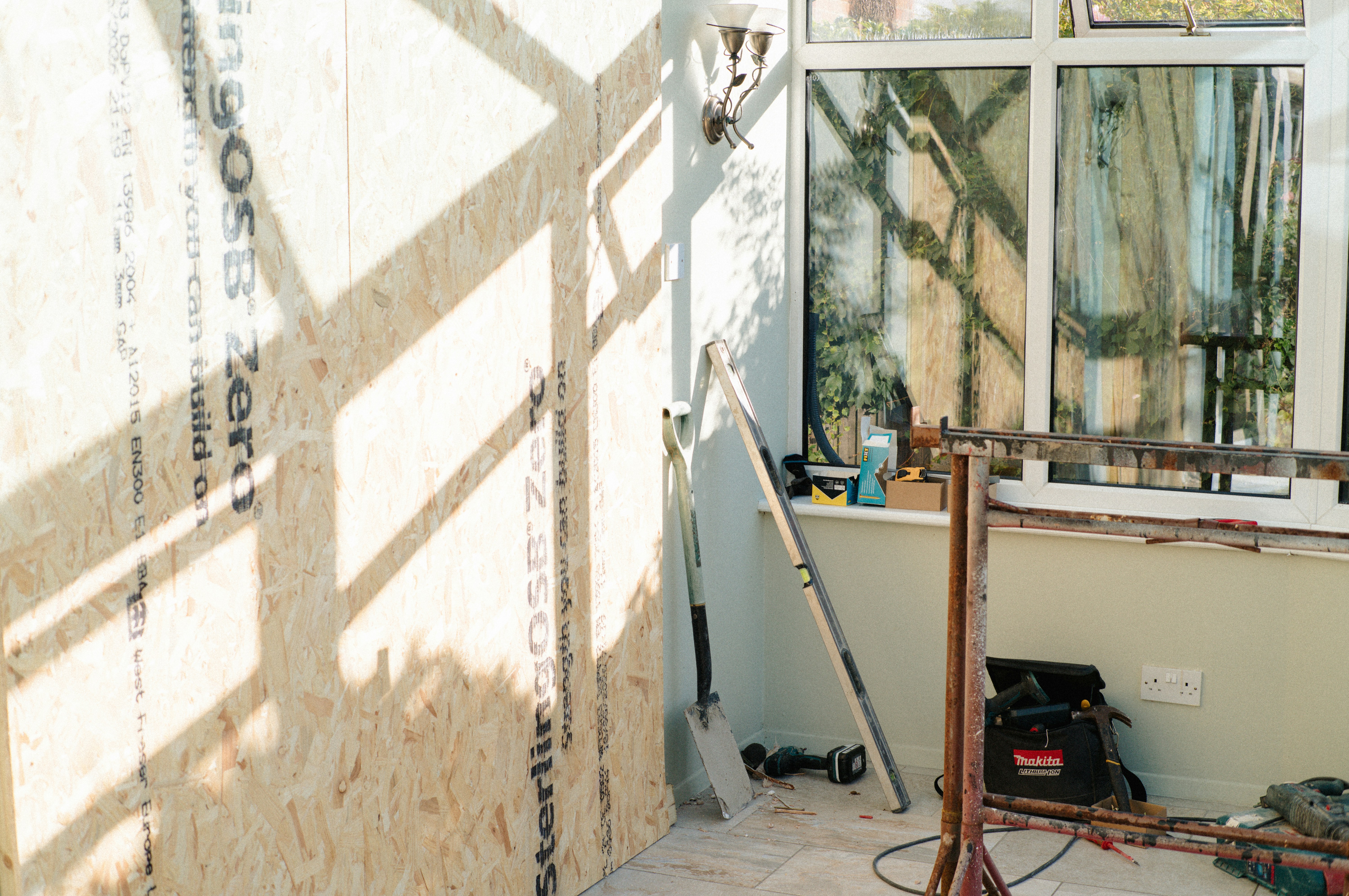 Sunlight casting shadows on osb wall during construction