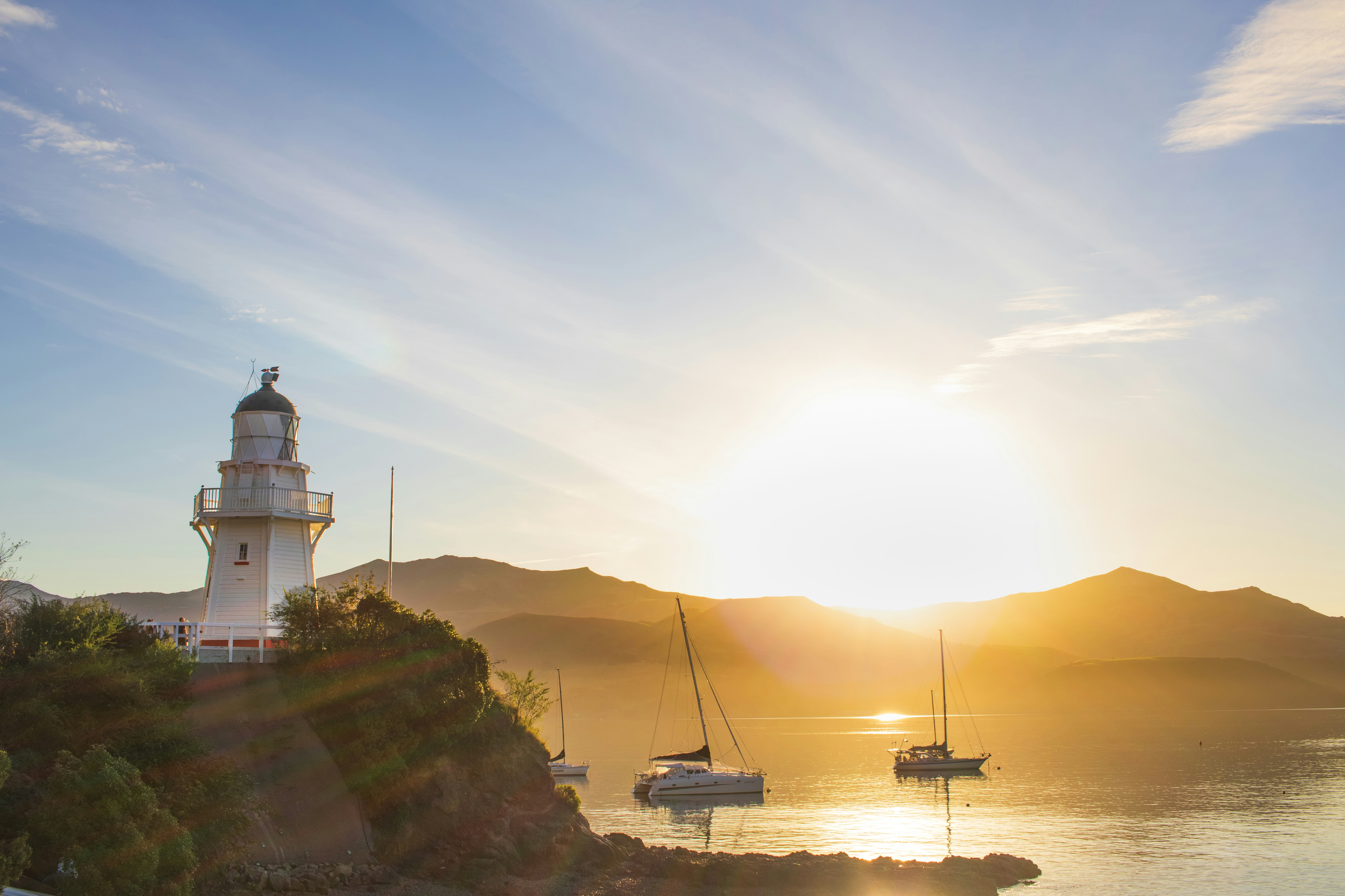 Lighthouse Mist and Sails at Sunset