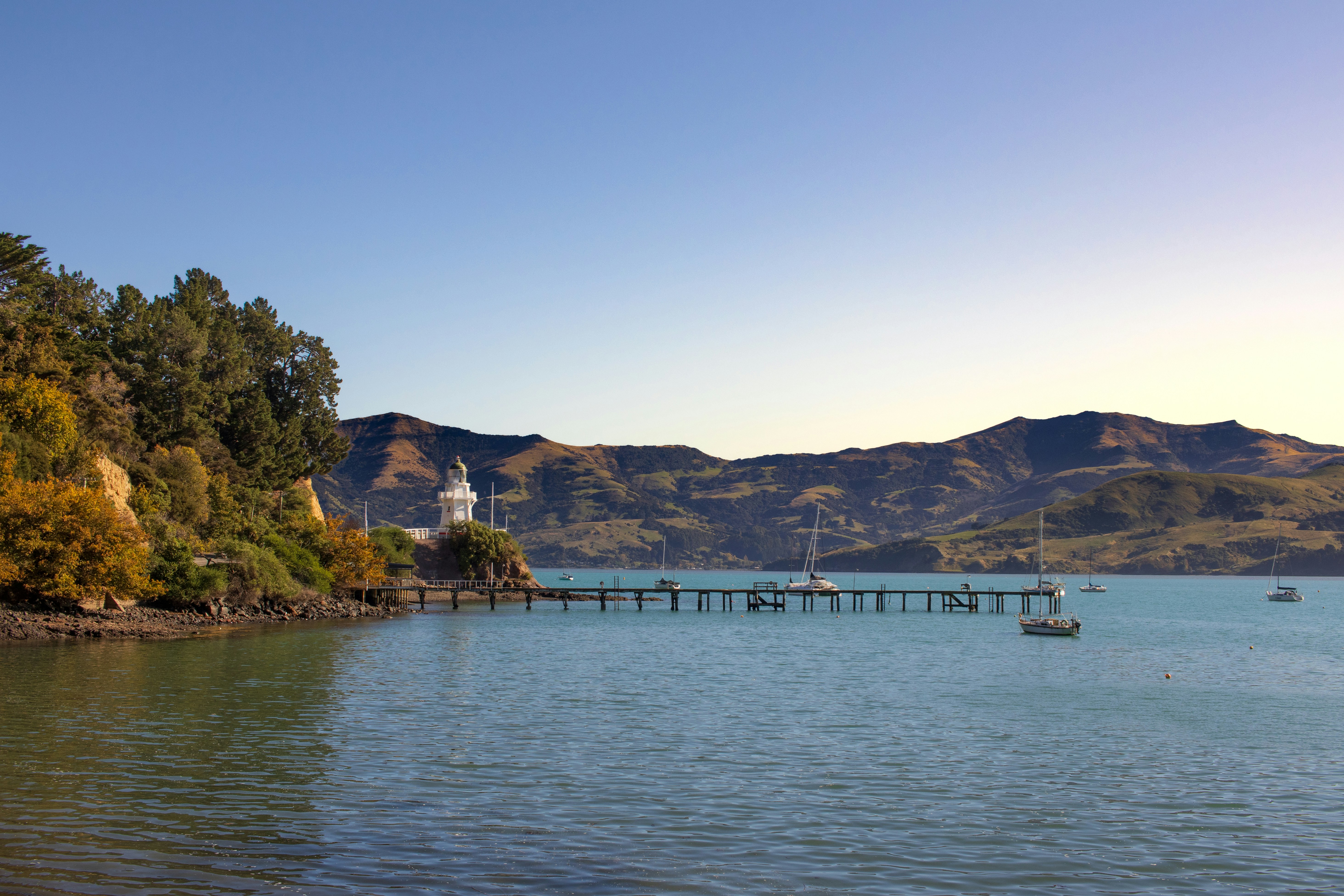 Harbor Dusk: A Quiet Pier Reaches Toward the Hills