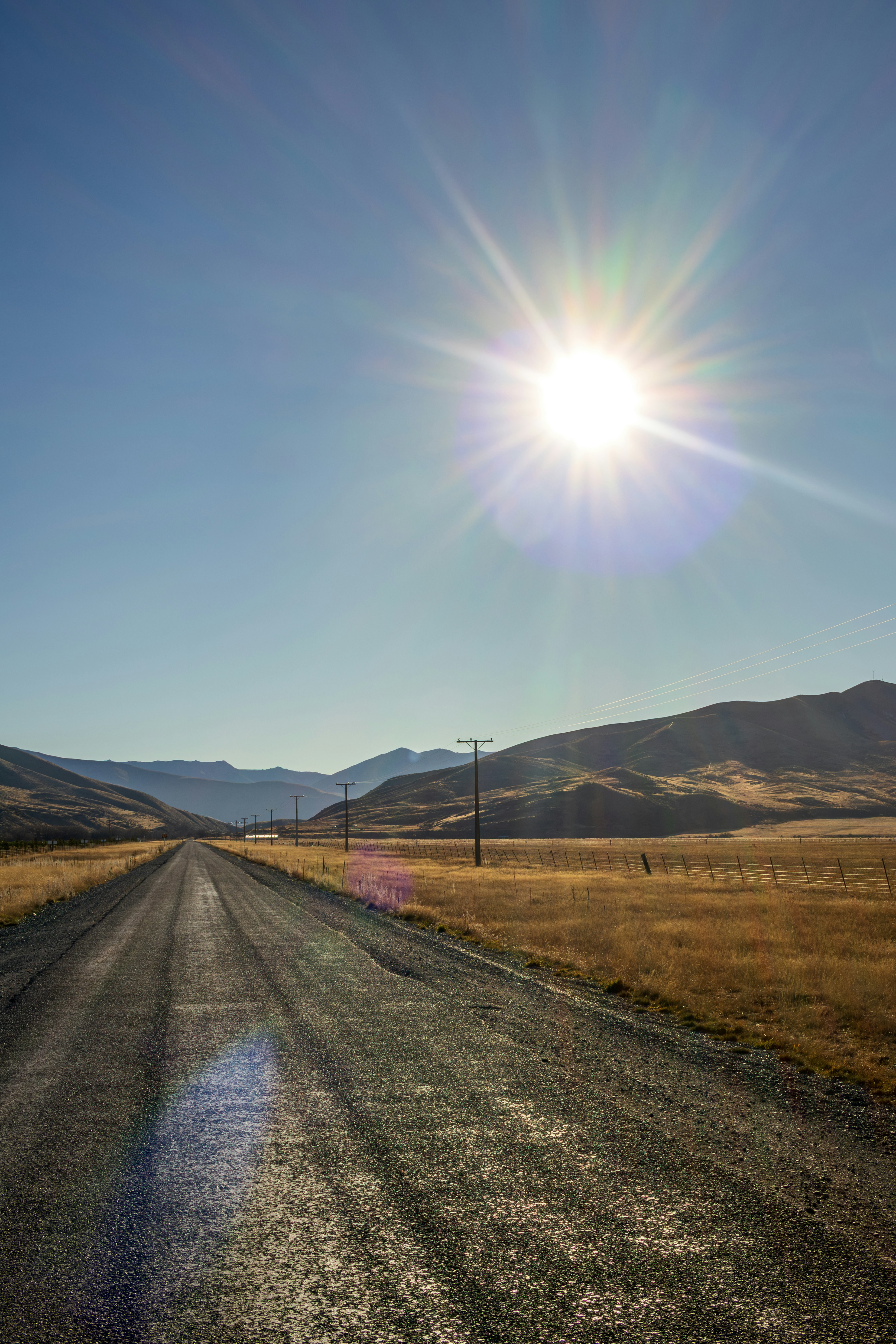 Desert Highway under a Glowing Noon