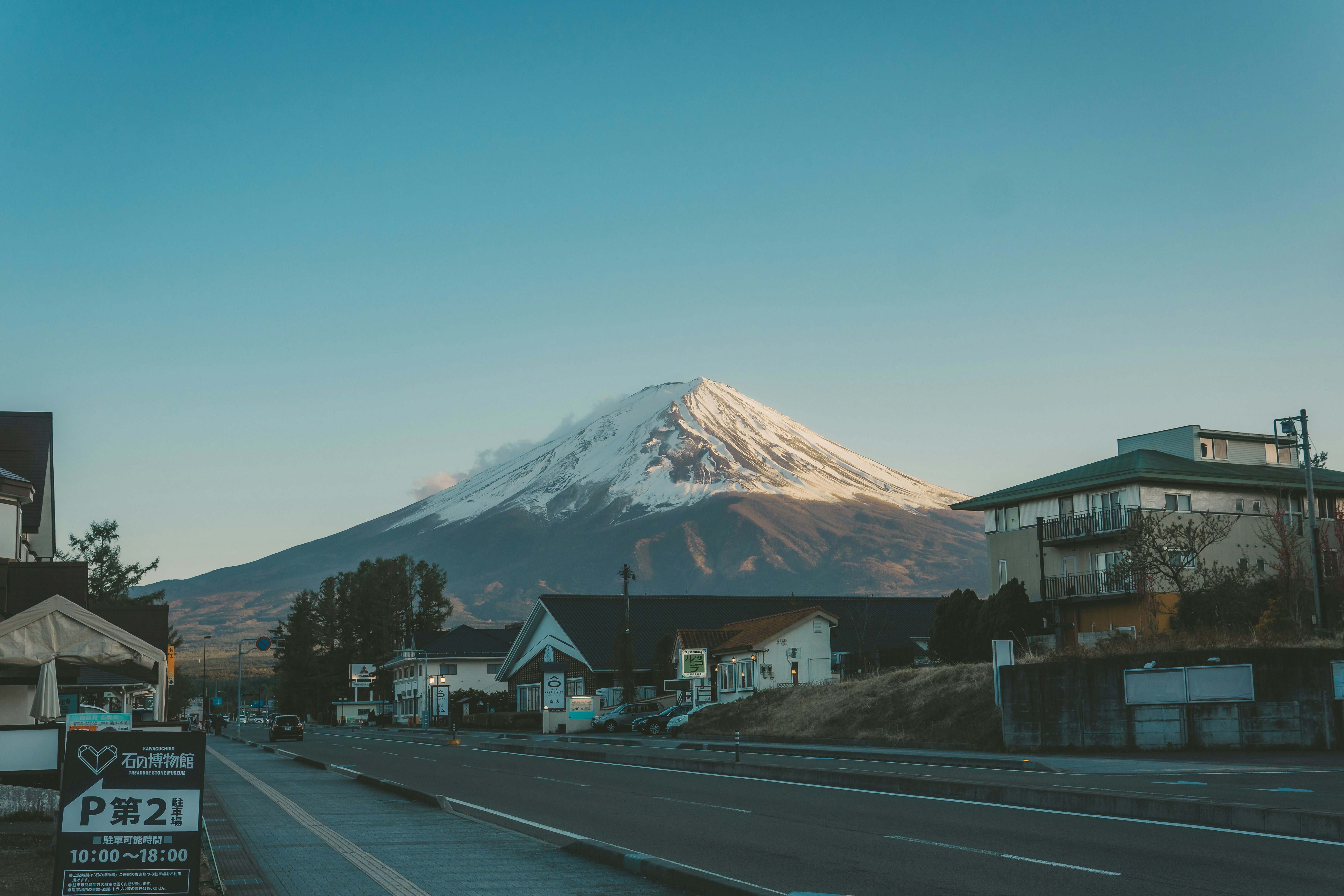 Snow-capped Peak Over a Quiet Suburban Road