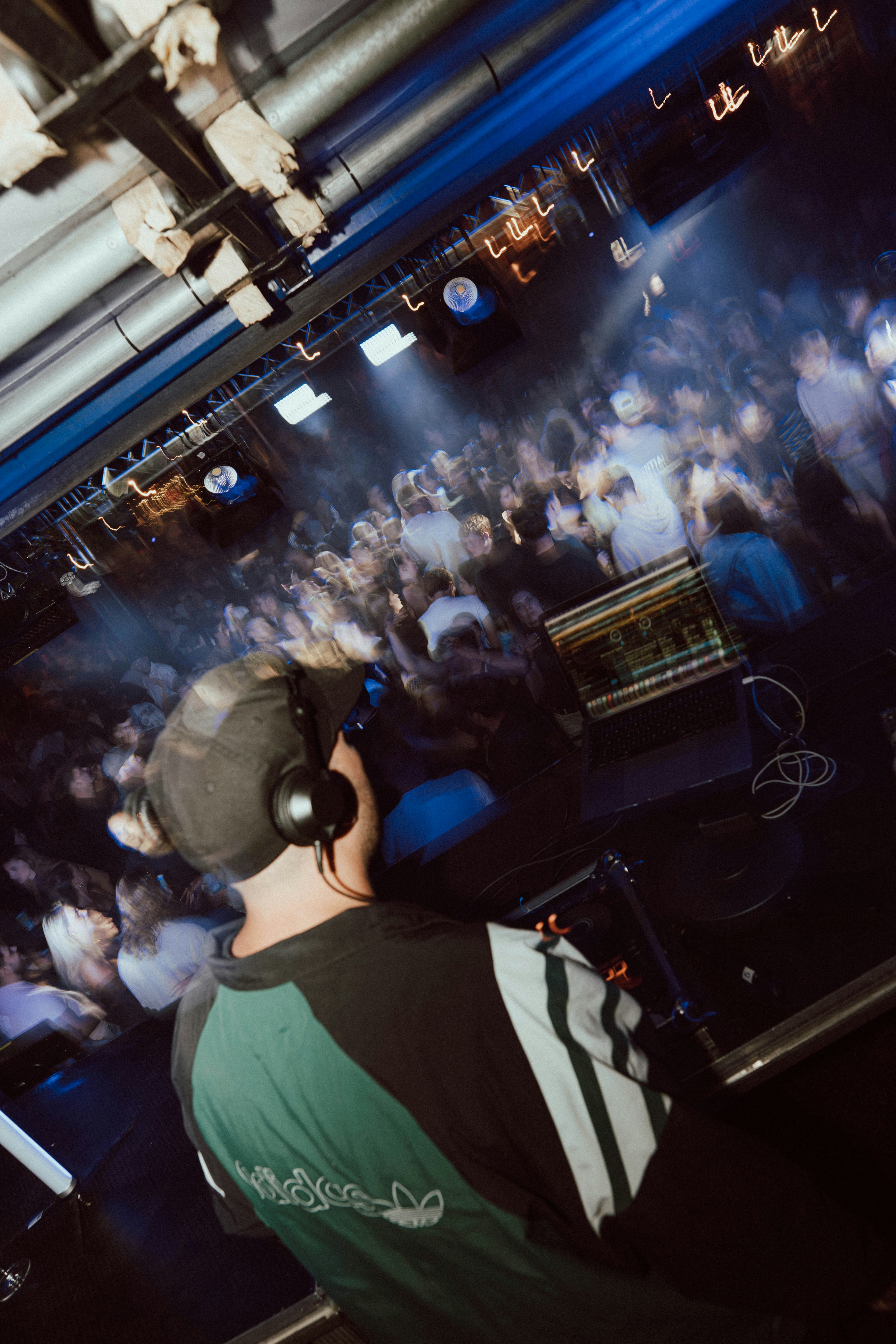 Night Pulse: A DJ in Motion Amid the Crowd
