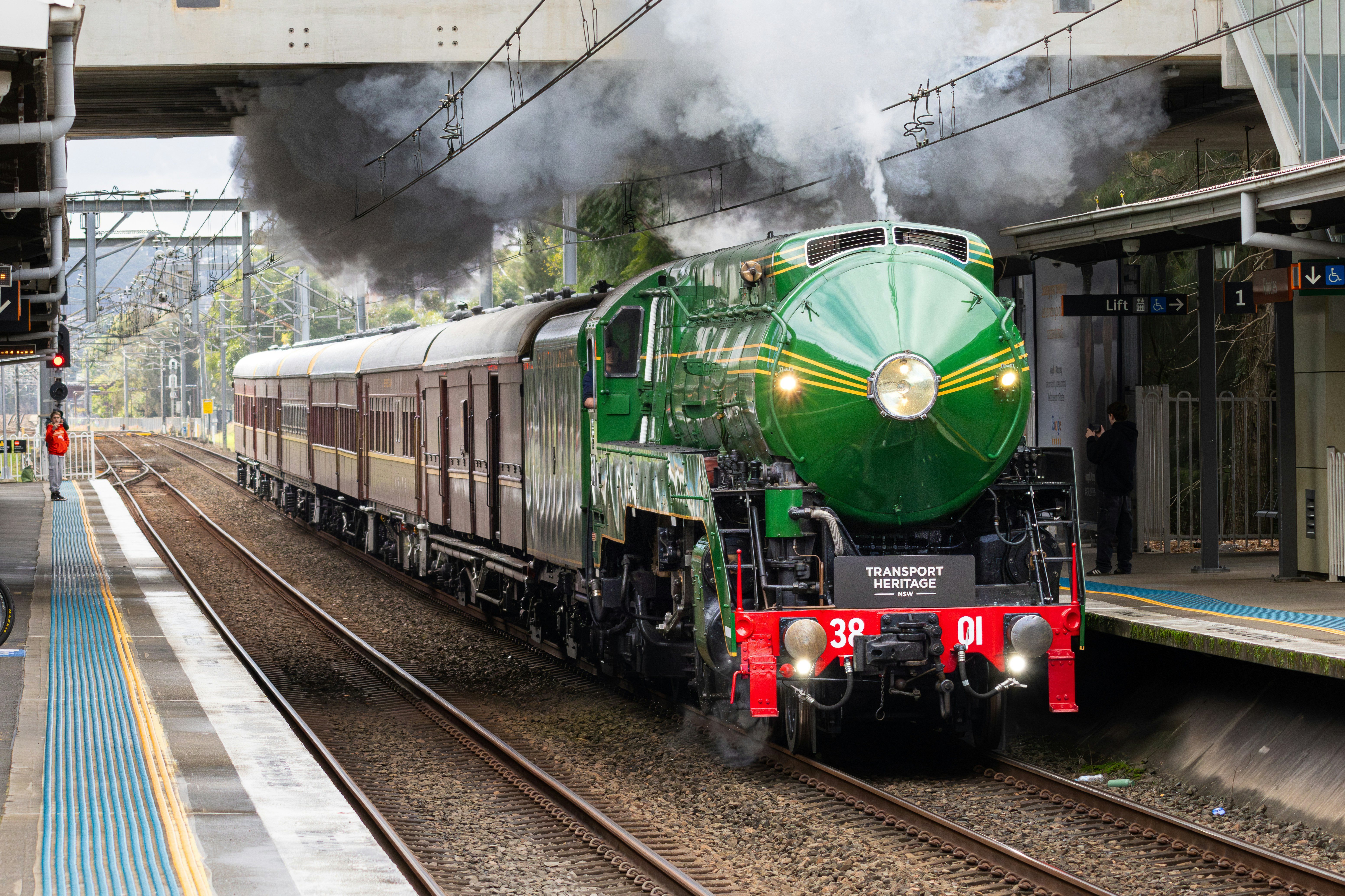 Green Classic: A steam locomotive bursts from the platform
