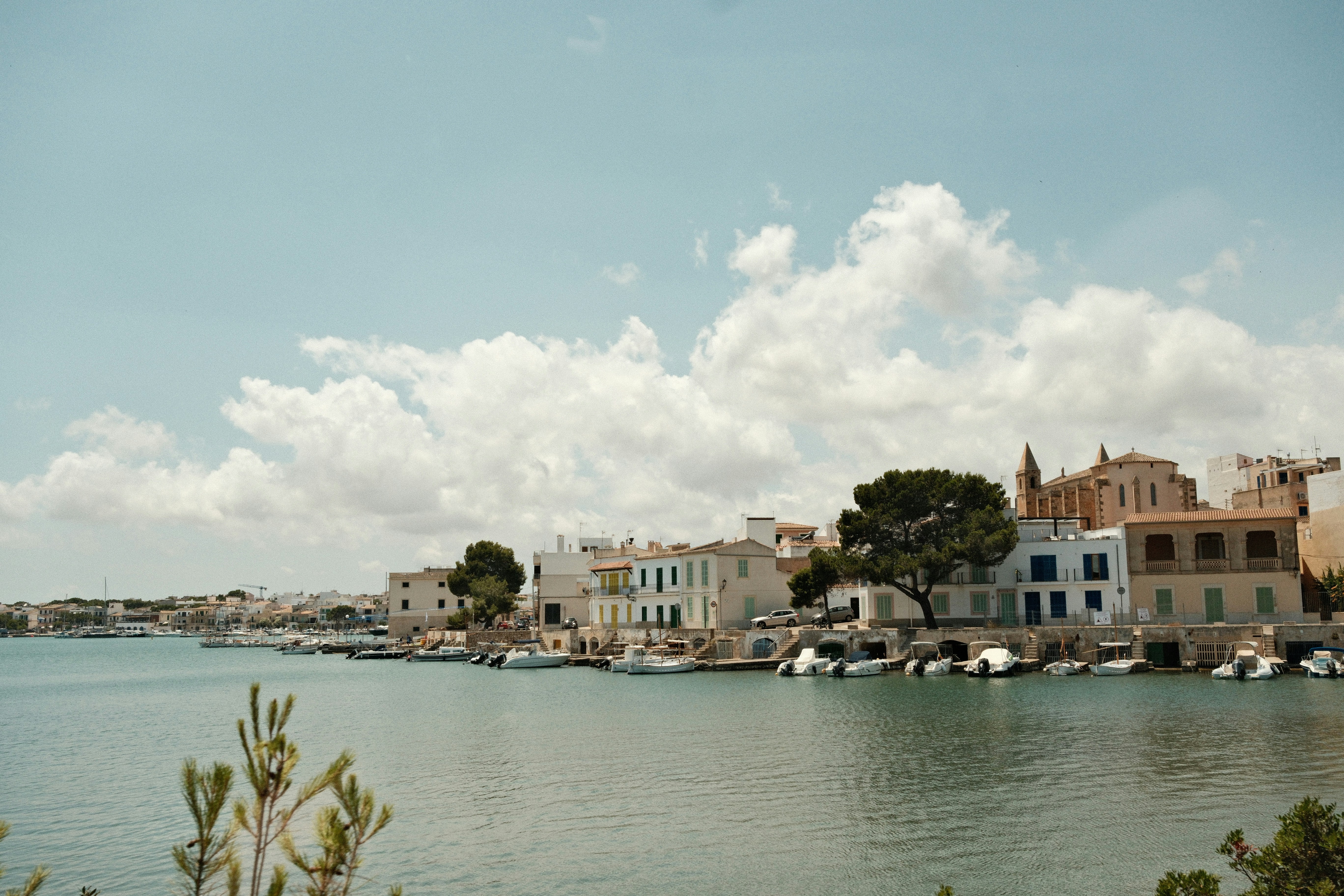 Harbor Village in Calm Sea Light