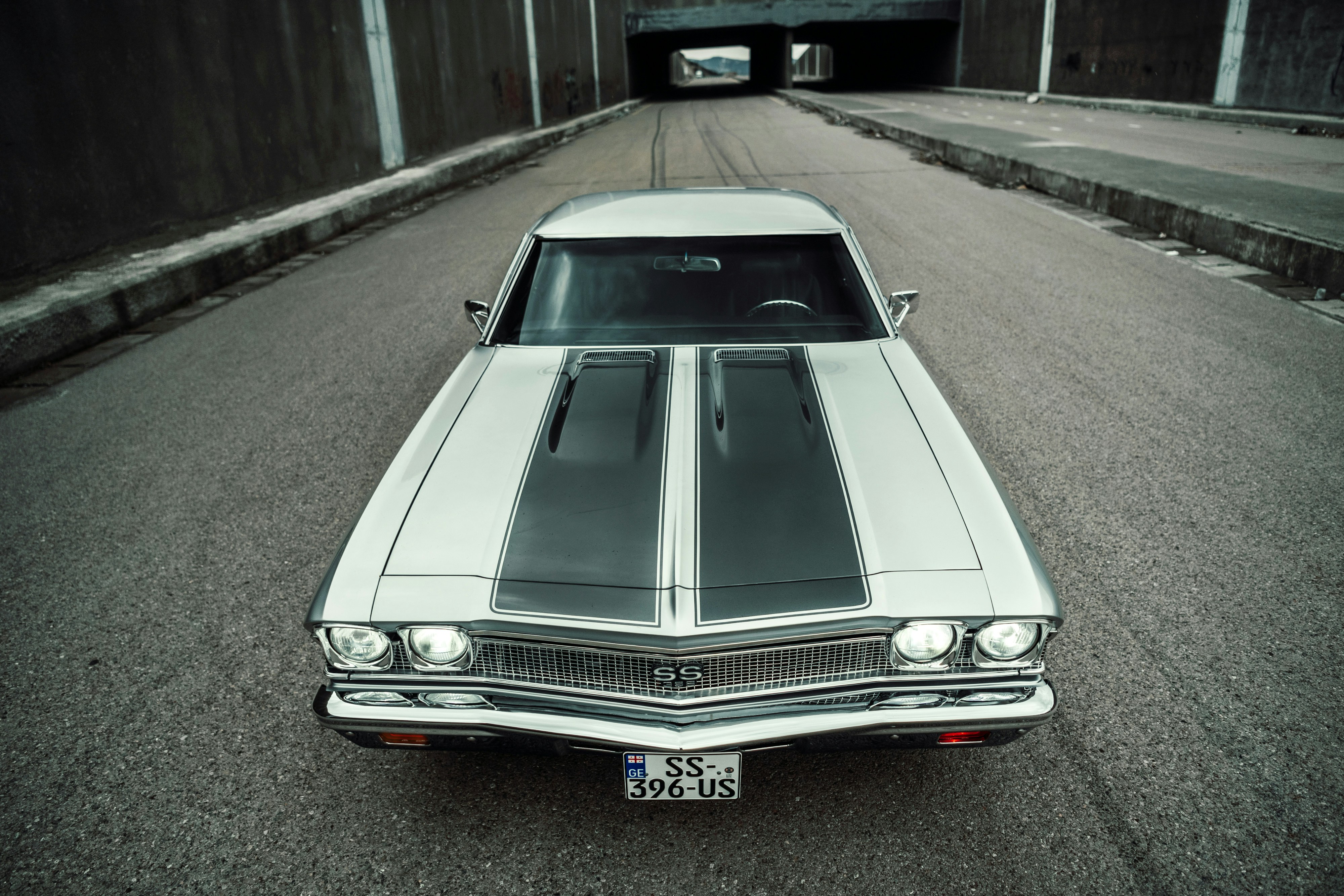 Chrome Crescent: Front-View of a Classic Cadillac Staring Down an Urban Tunnel