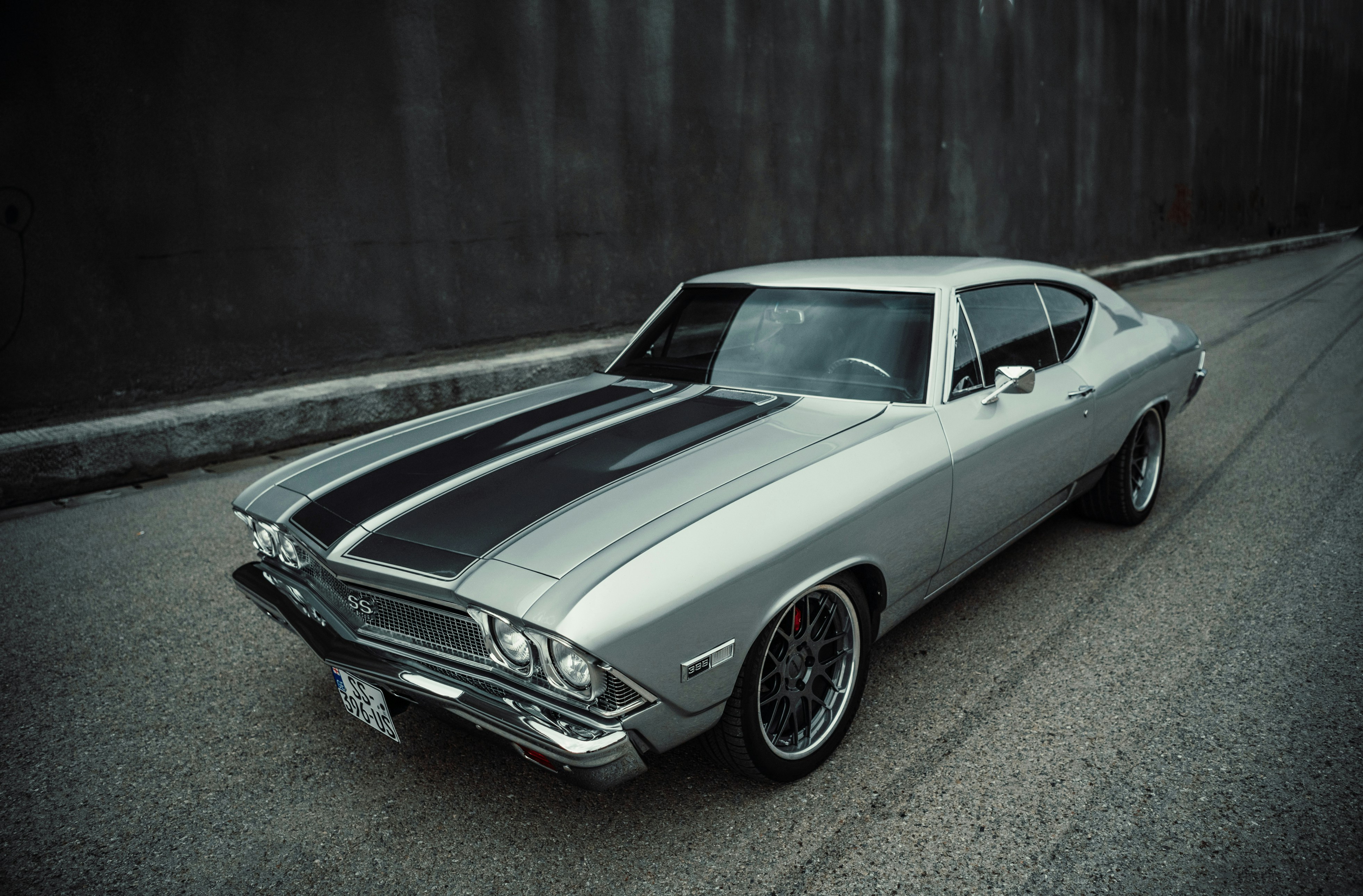 Stripes in Motion: Classic Muscle Car Under Overcast Haze